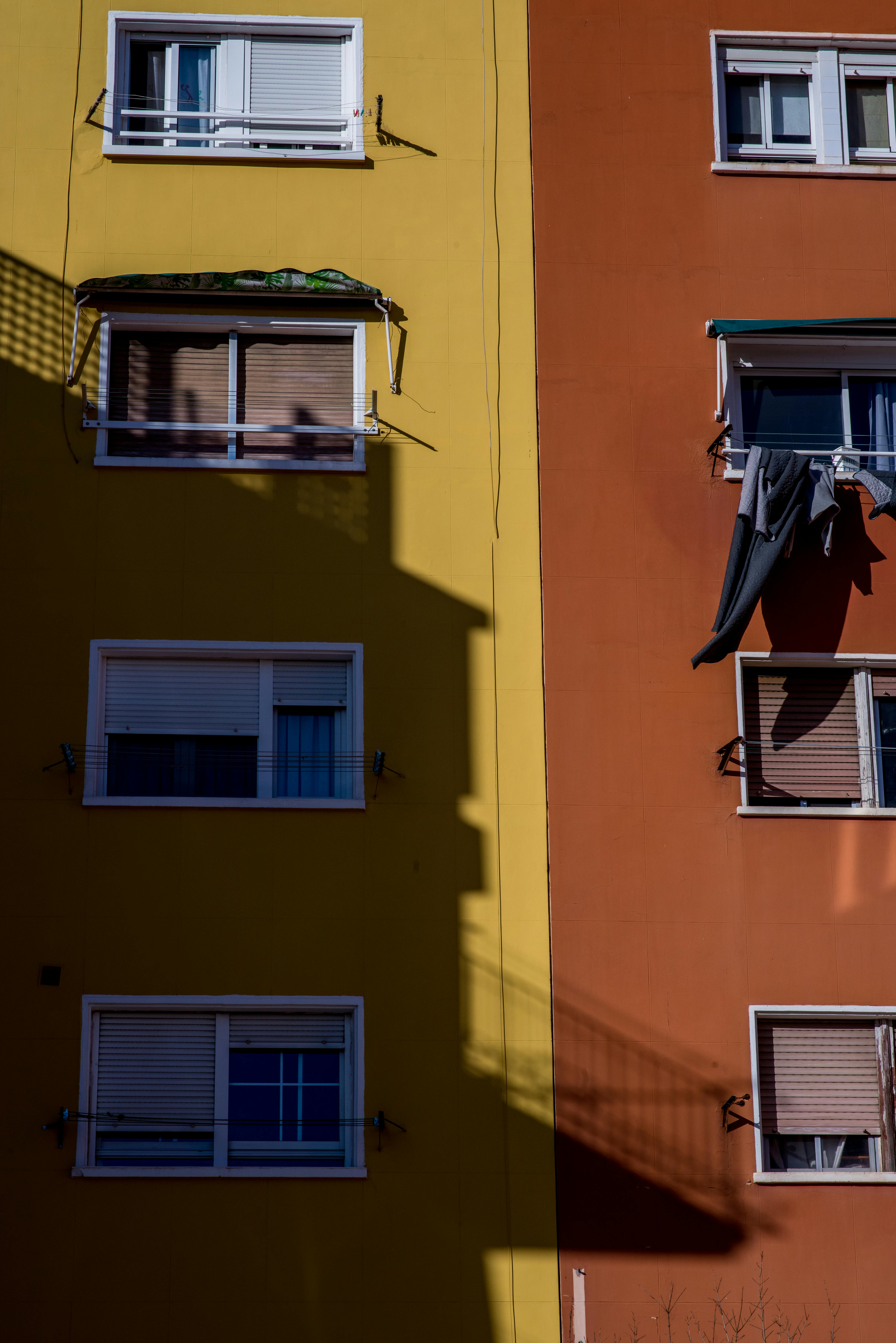 Colorful Apartment Building Facade at Sunset · Free Stock Photo