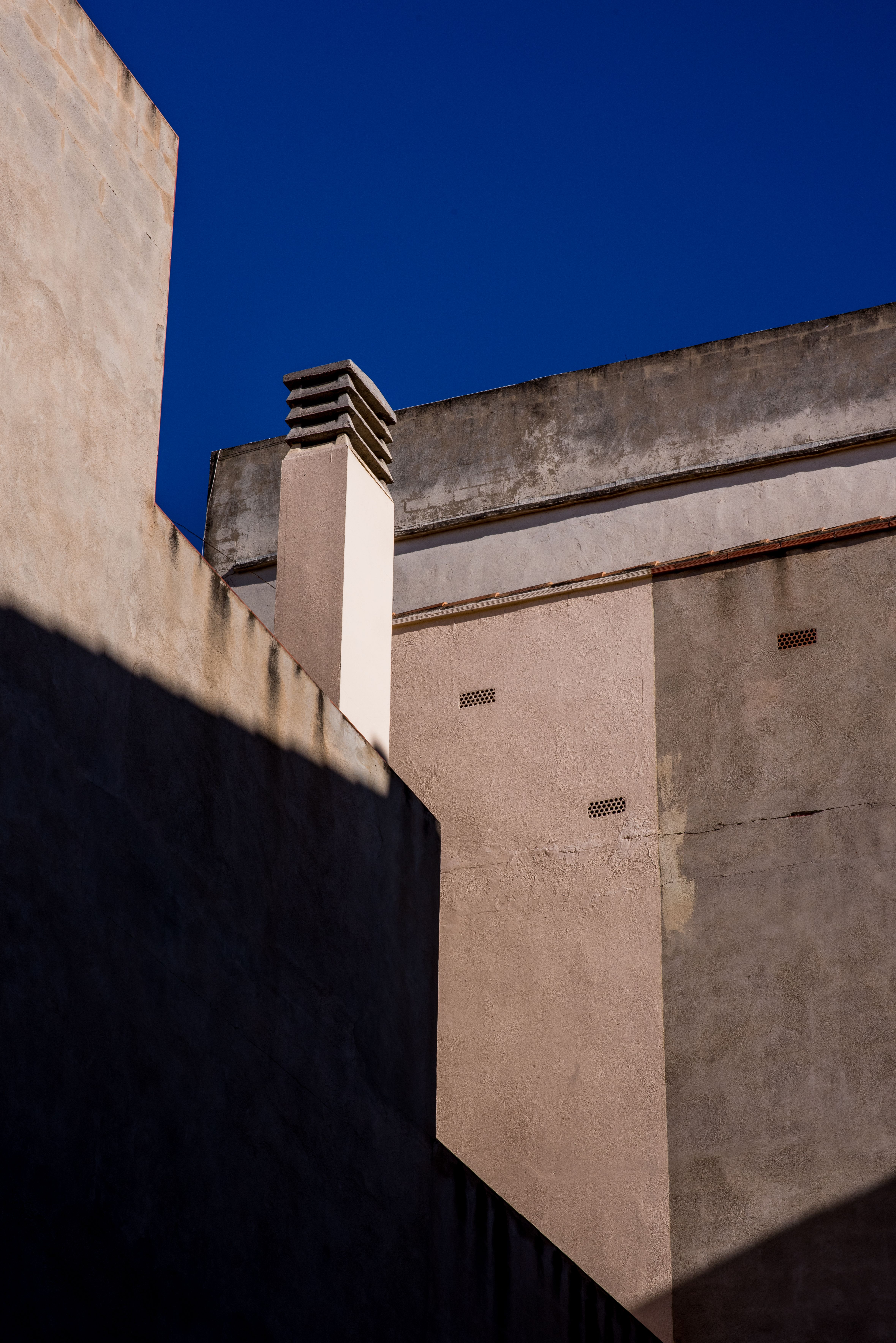 Geometric Shadows on Urban Building Architecture · Free Stock Photo