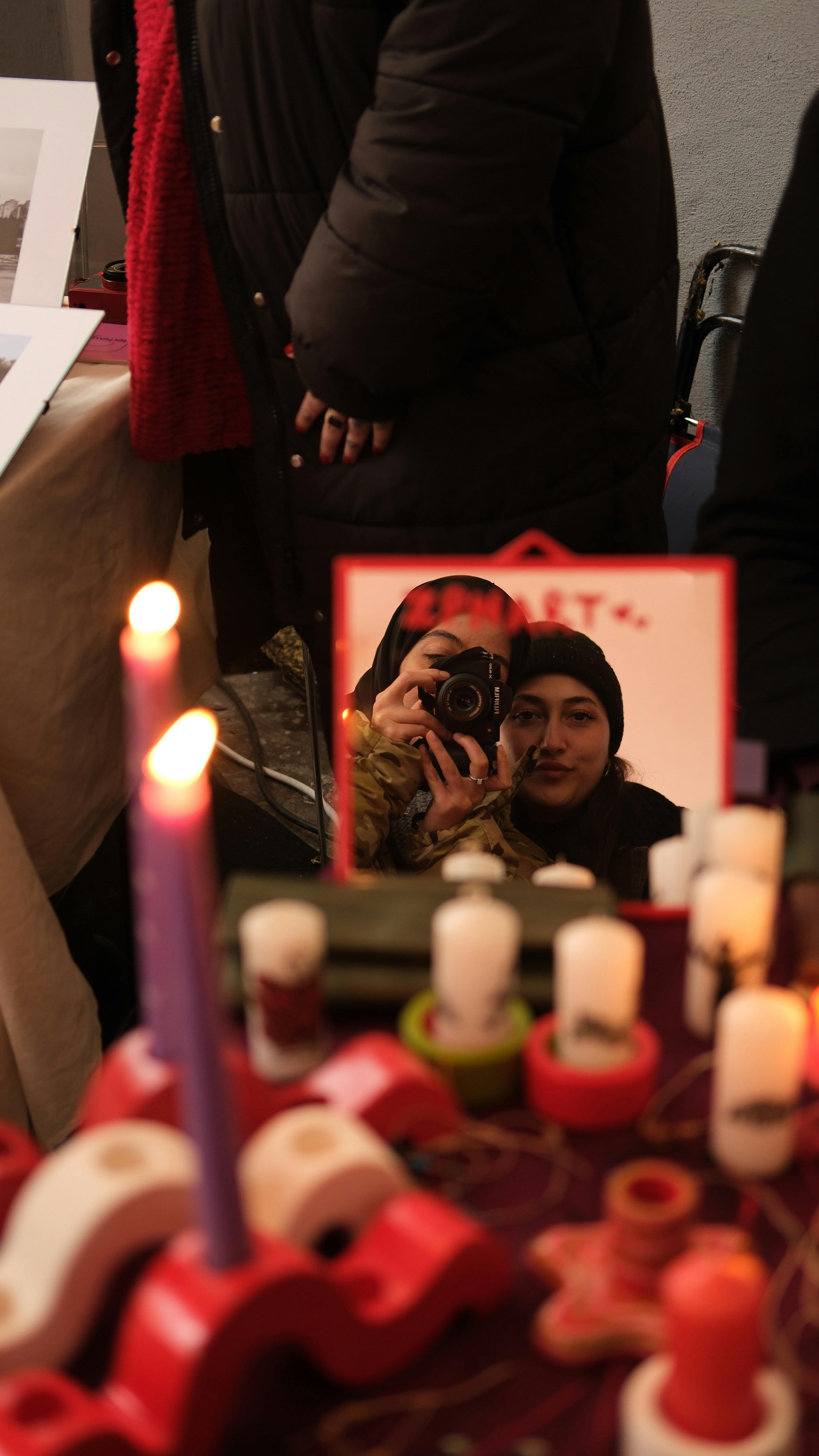 Candid Reflection with Candles at Indoor Market · Free Stock Photo