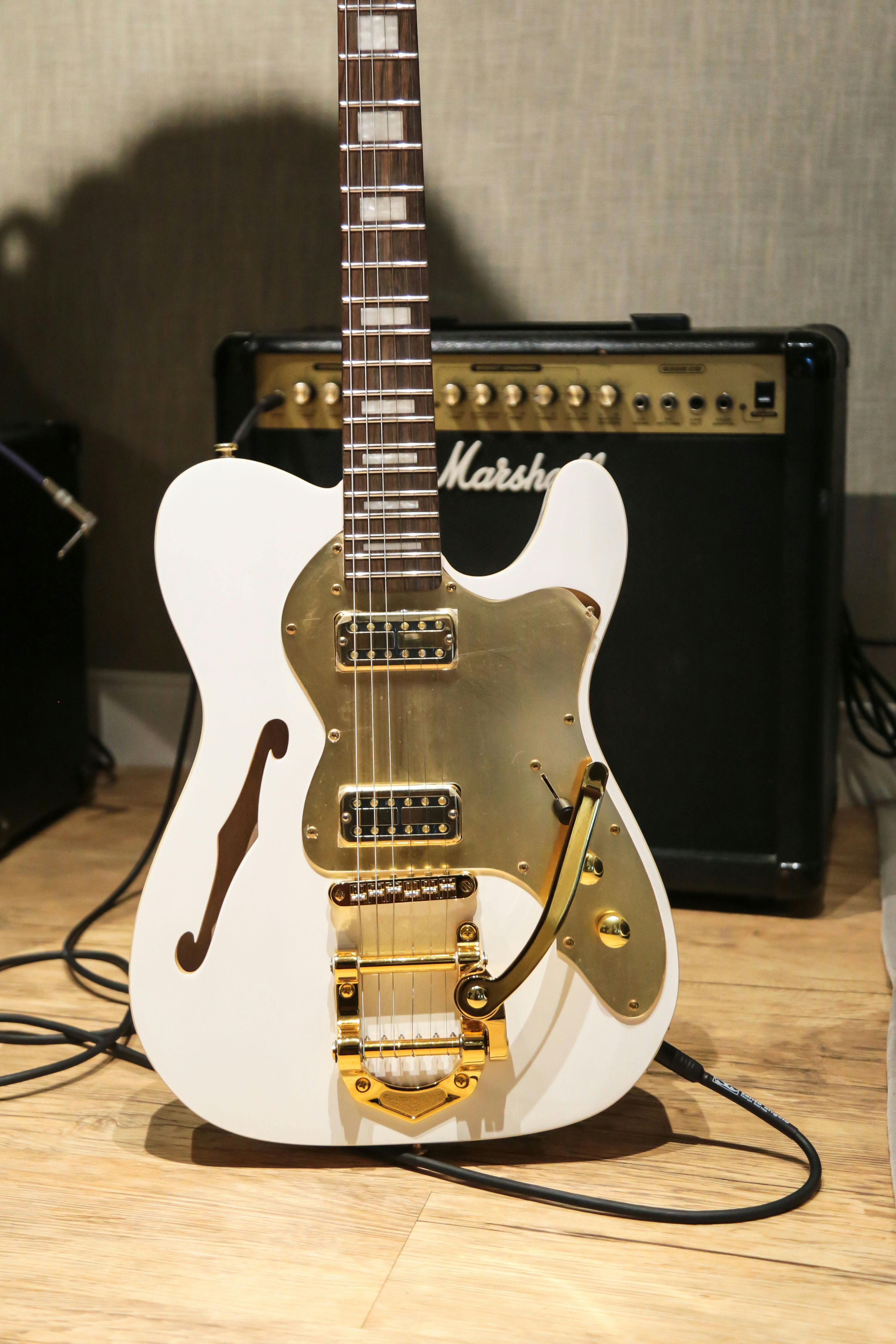 White Electric Guitar with Amplifier in Studio · Free Stock Photo
