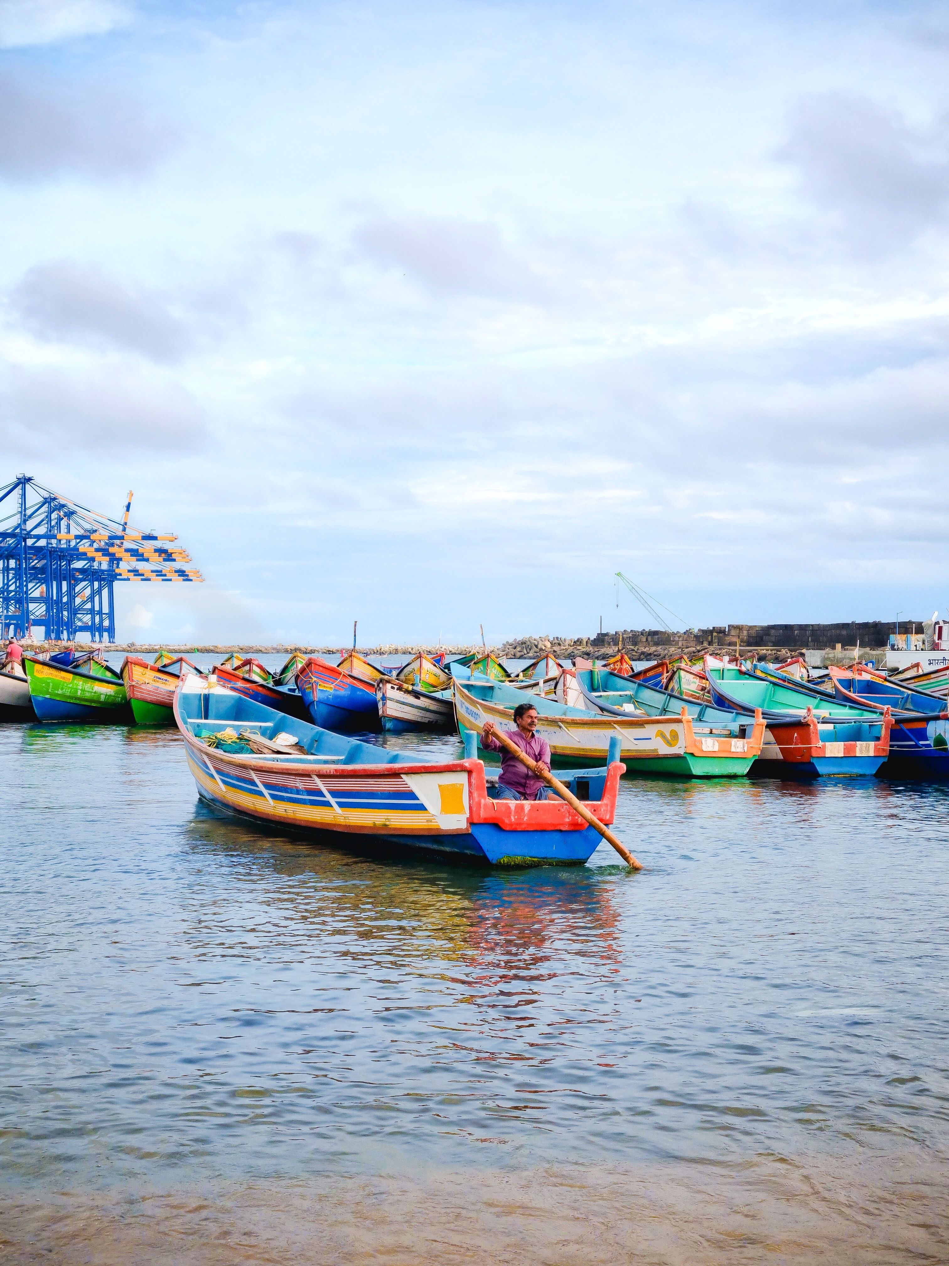 Colorful Fishing Boats in Kovalam Harbor · Free Stock Photo