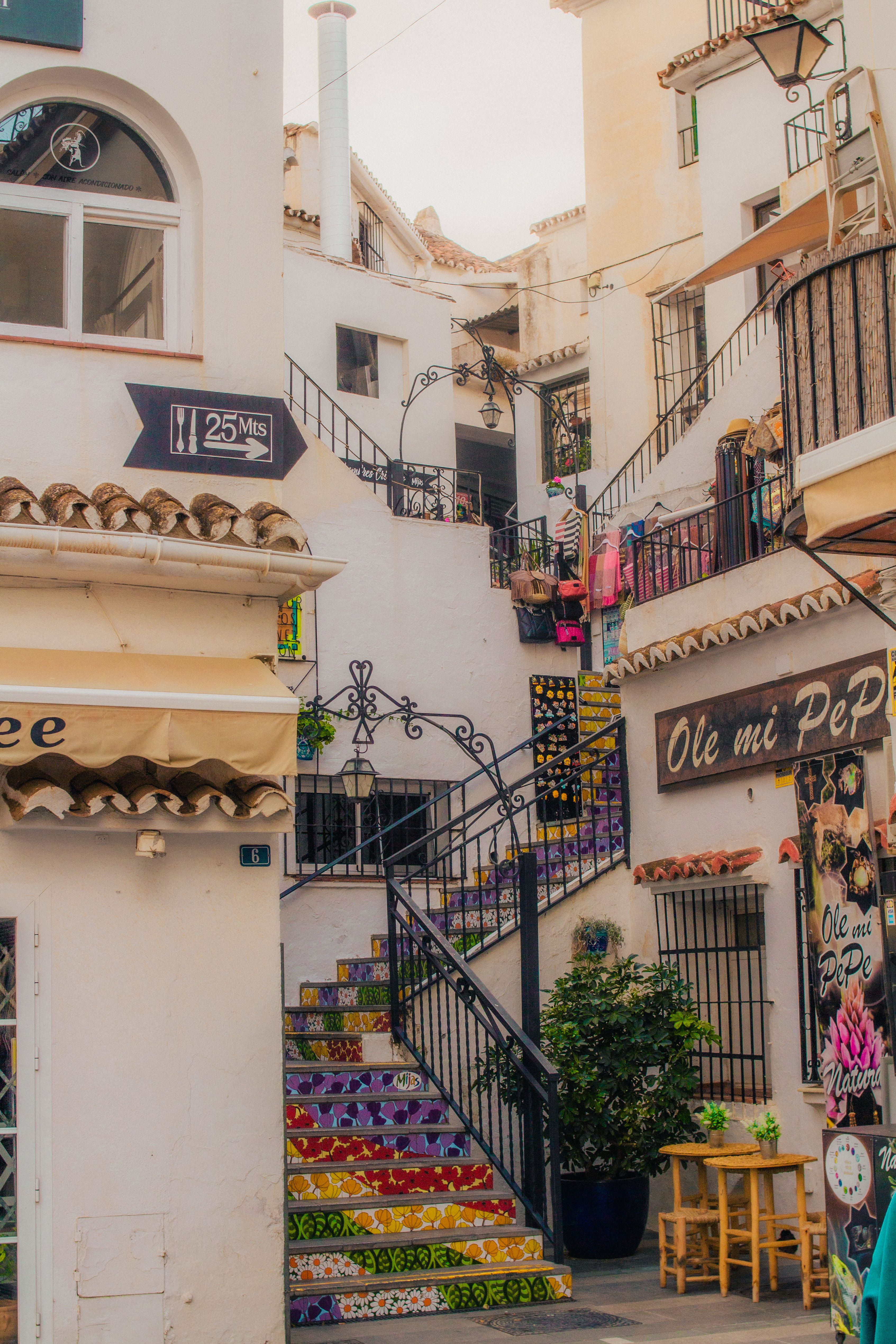 Colorful Spanish Street Scene with Artistic Staircase · Free Stock Photo