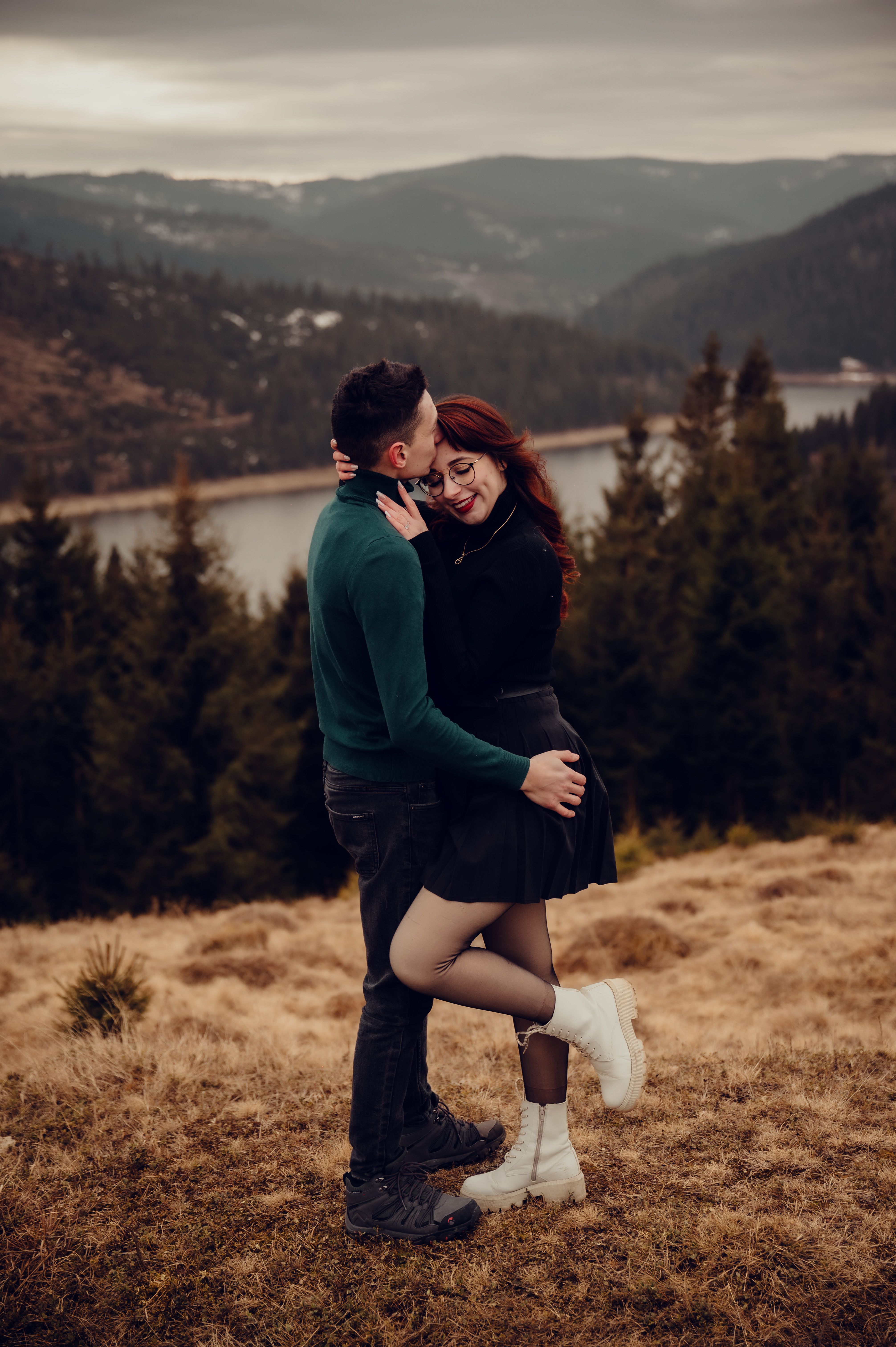 Romantic Couple Embracing in Autumn Landscape · Free Stock Photo