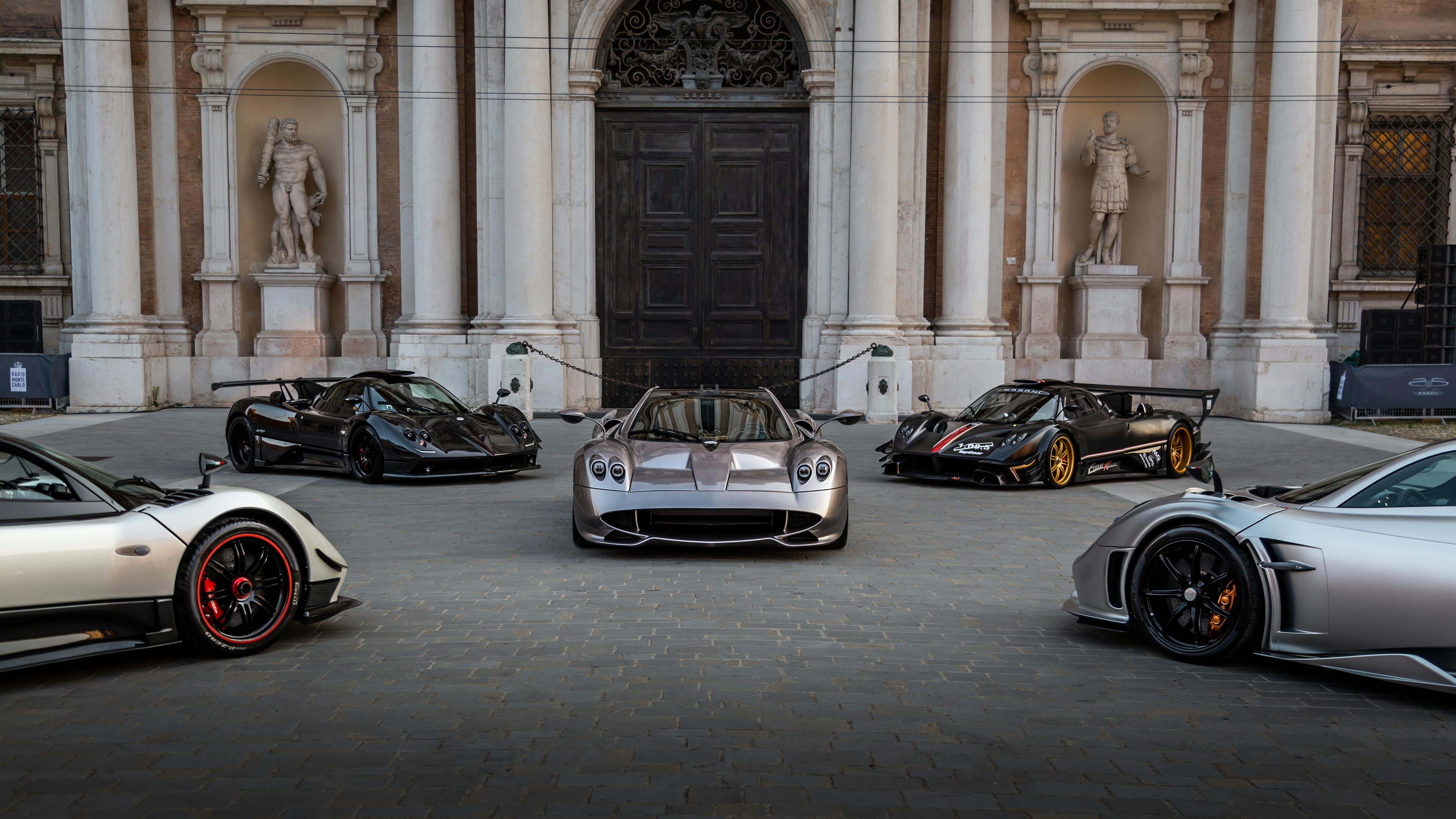 Luxury Hypercars in Front of Historic Building · Free Stock Photo