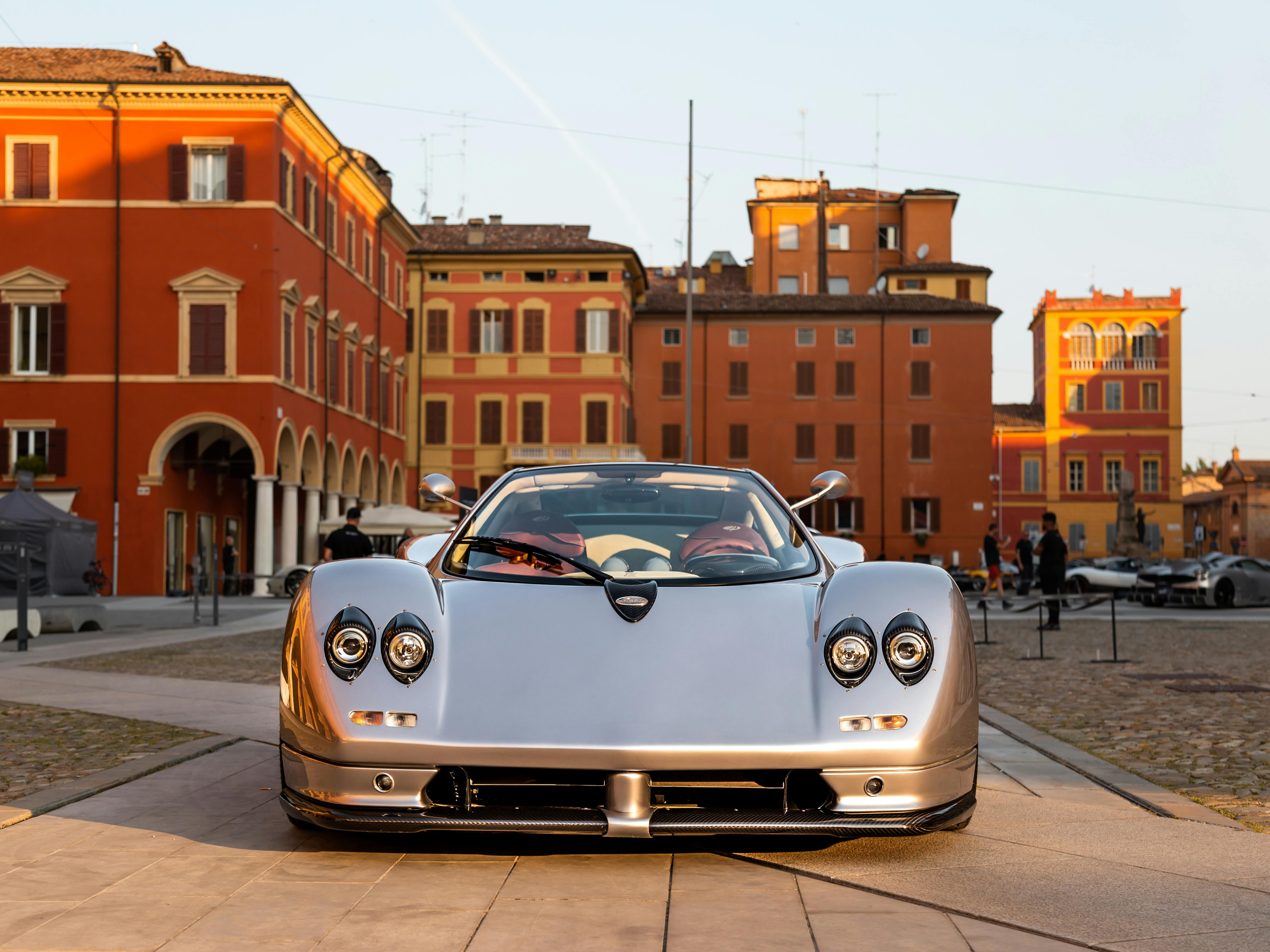 Silver Supercar in Italian Piazza at Sunset · Free Stock Photo