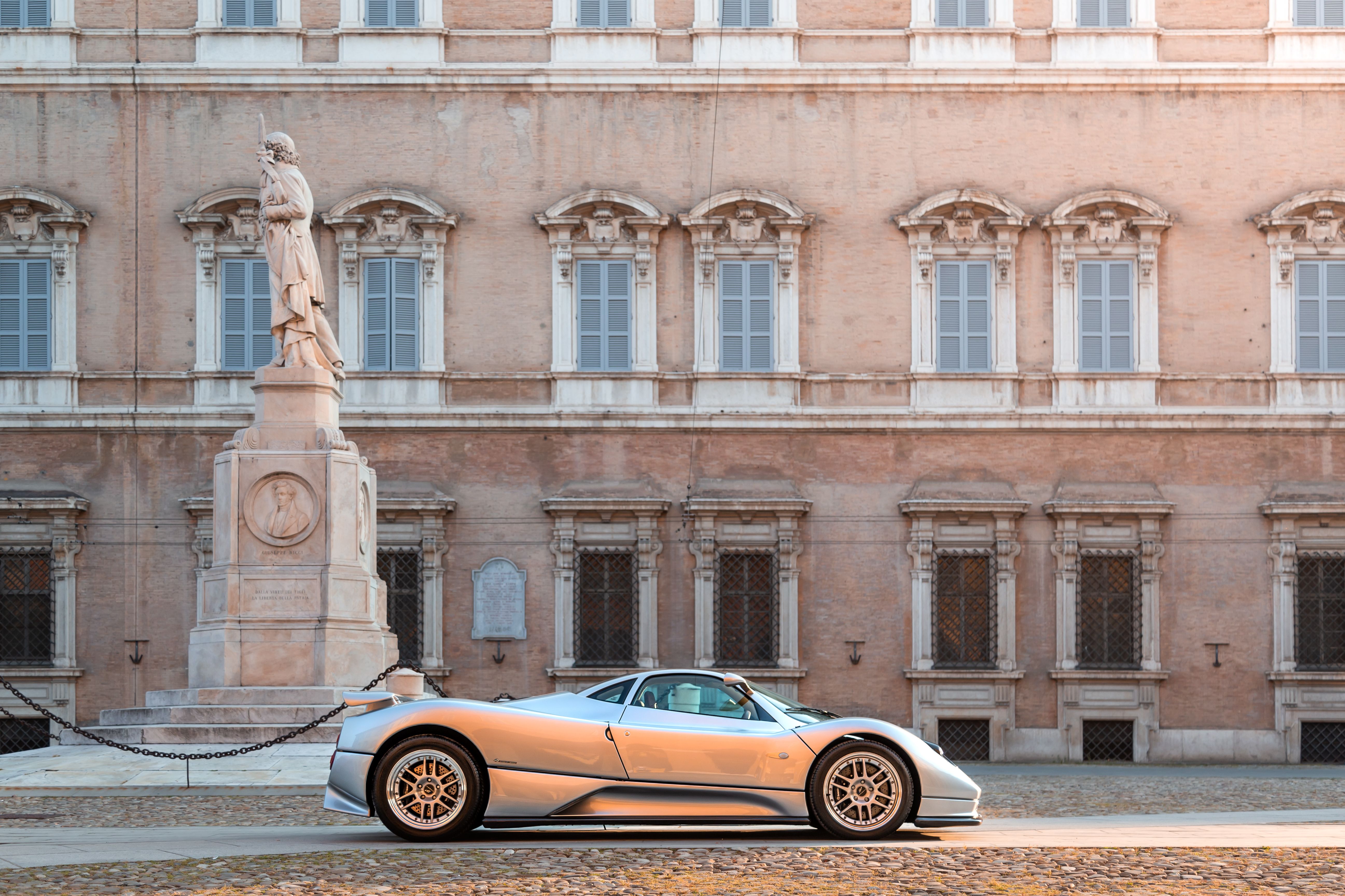 Sleek Silver Sports Car in Italian Courtyard · Free Stock Photo