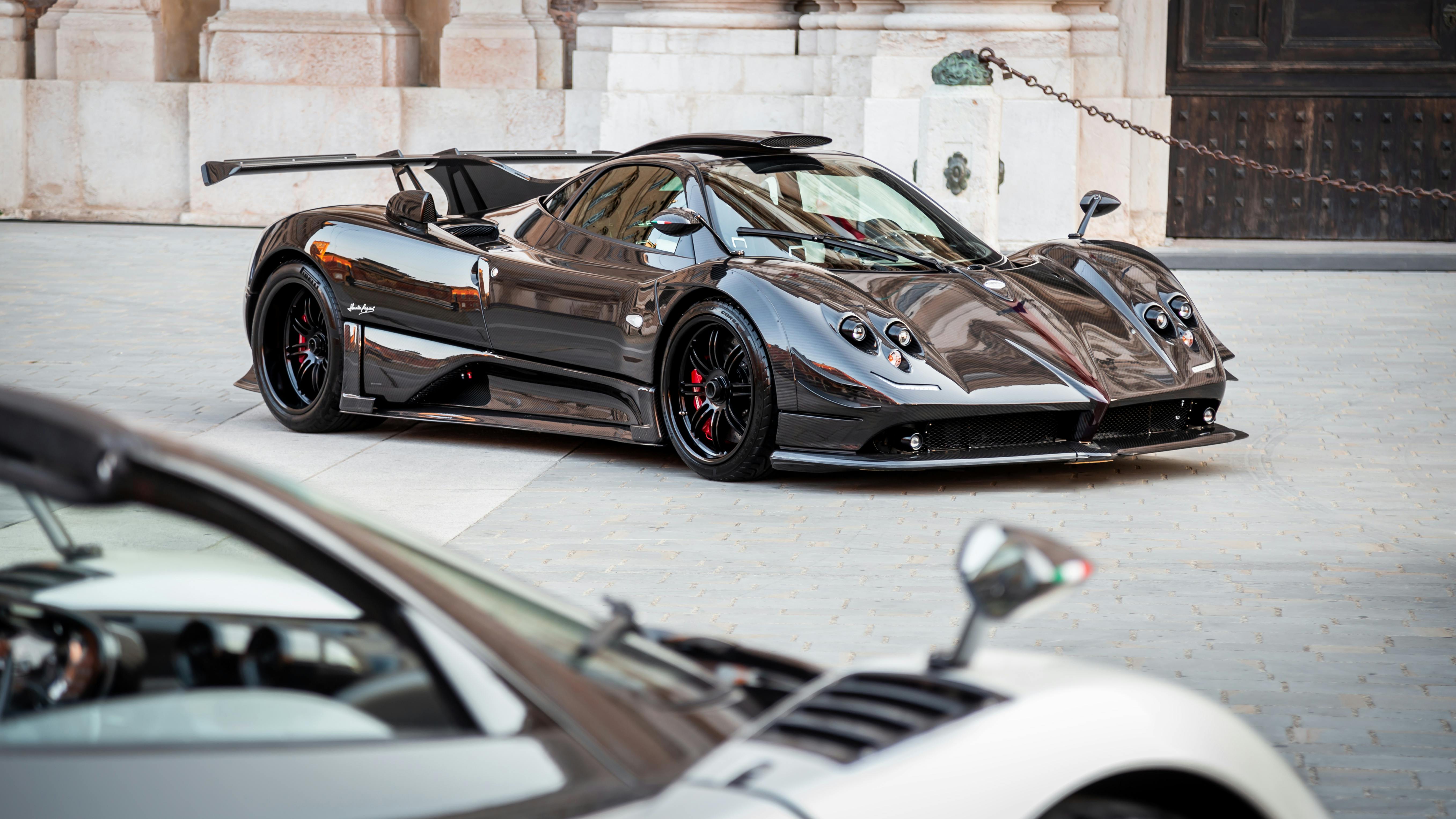 Sleek Black Supercar Display in Urban Setting · Free Stock Photo