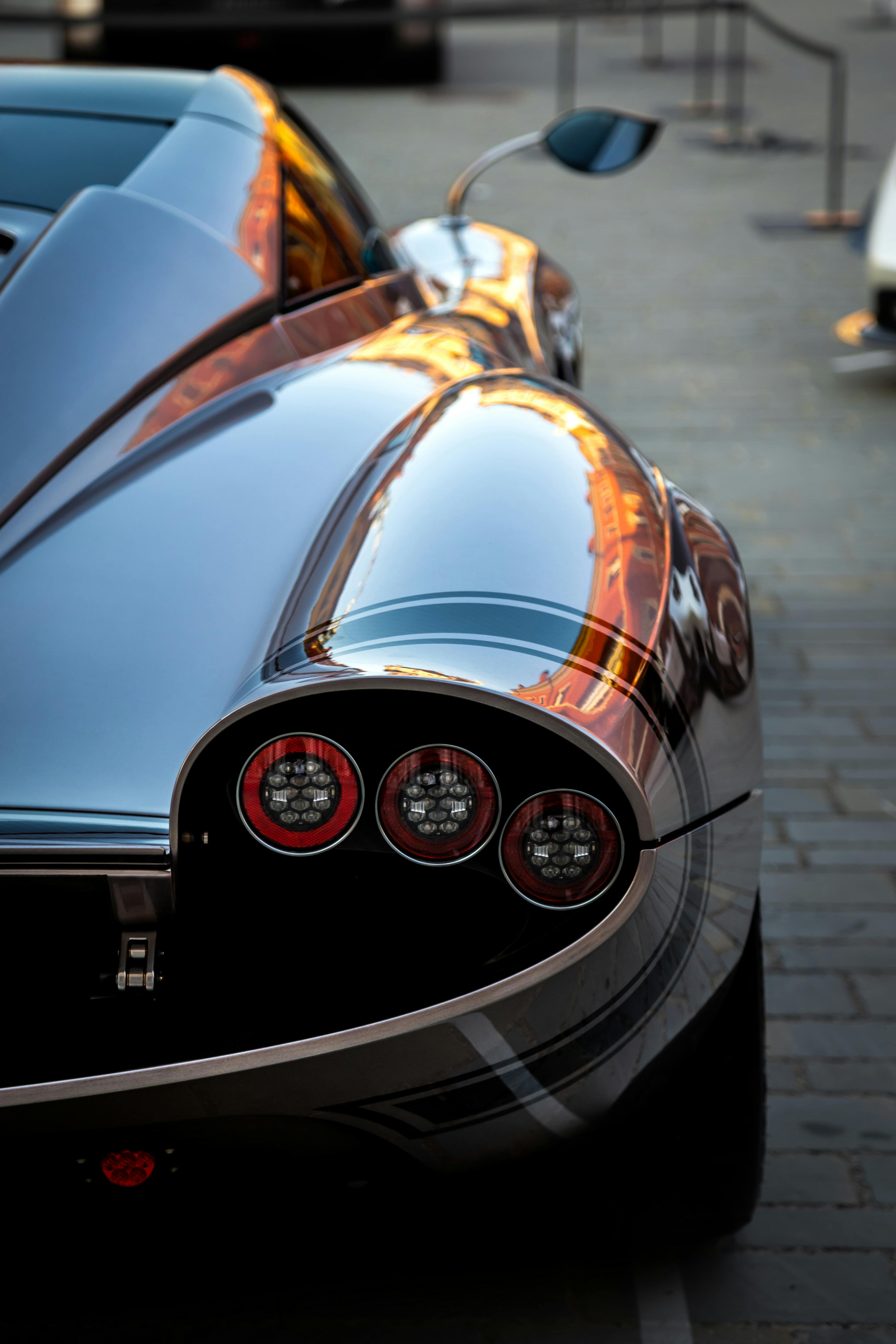 Sleek Hypercar Close-Up at Sunset Outdoors · Free Stock Photo