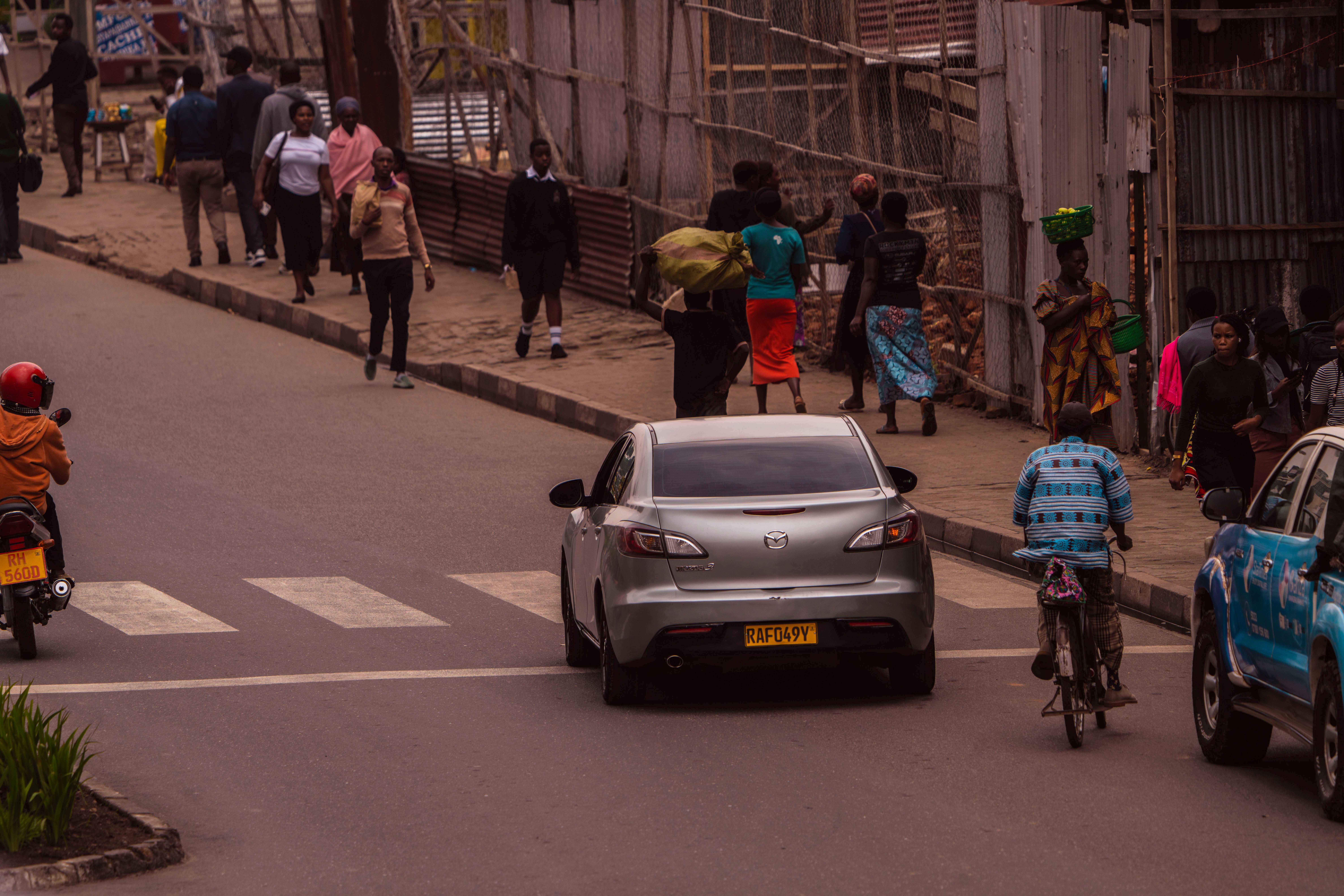 Busy Urban Street Scene with Traffic and Pedestrians · Free Stock Photo
