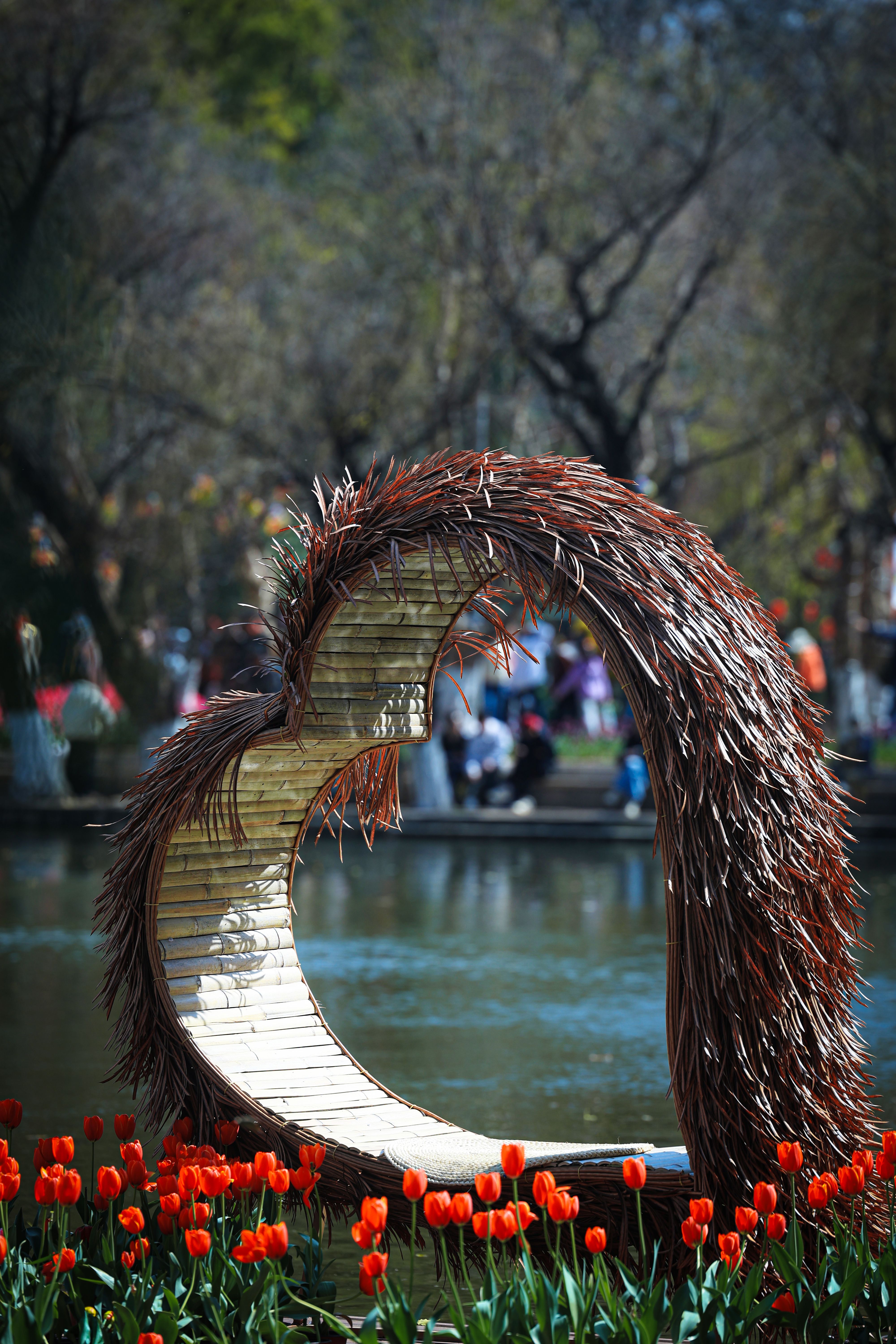 Sculptural Art Overlooking Tulip Garden in Spring · Free Stock Photo