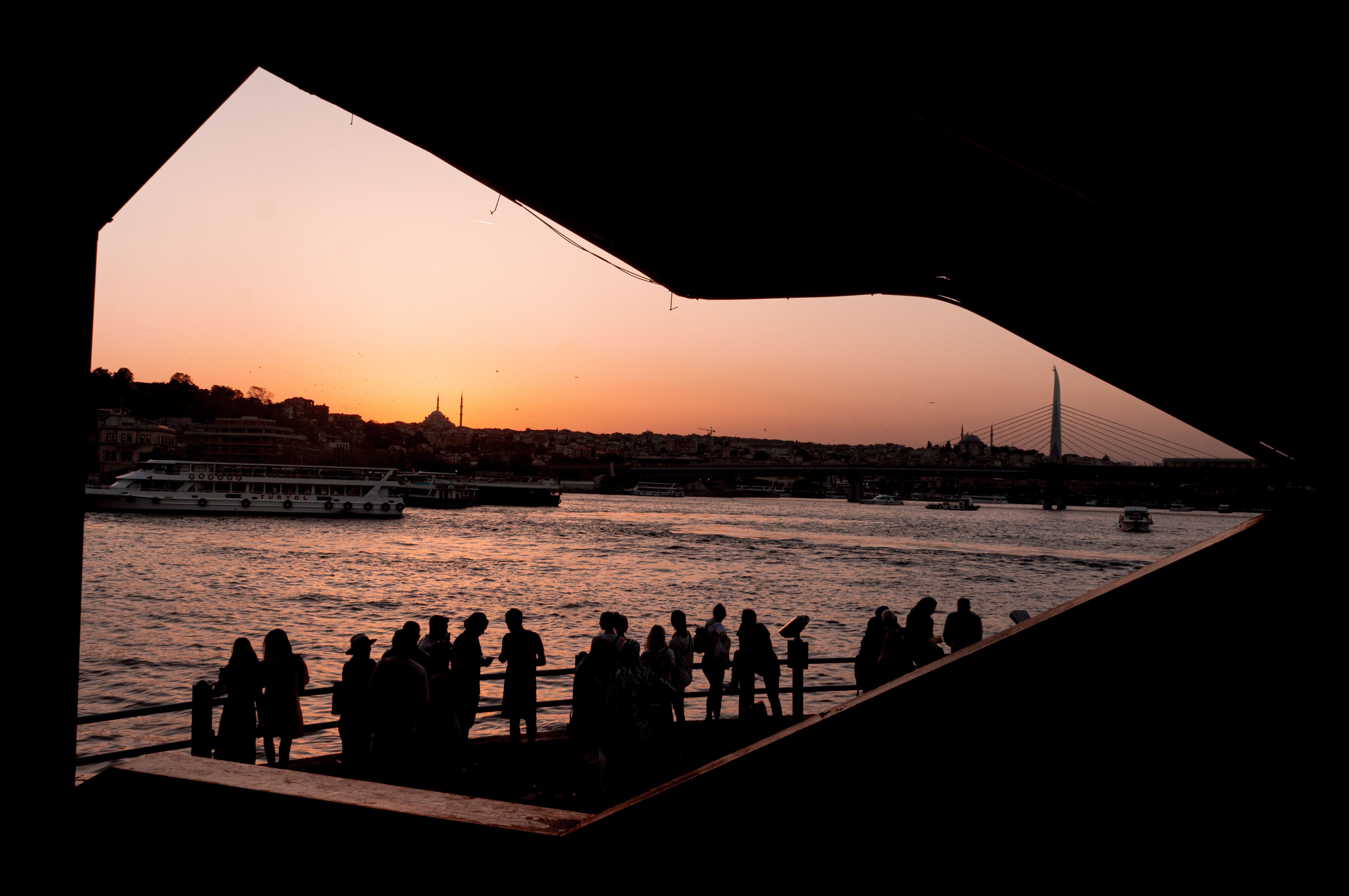 Silhouetted Crowd Overlooking Golden Horn at Sunset · Free Stock Photo