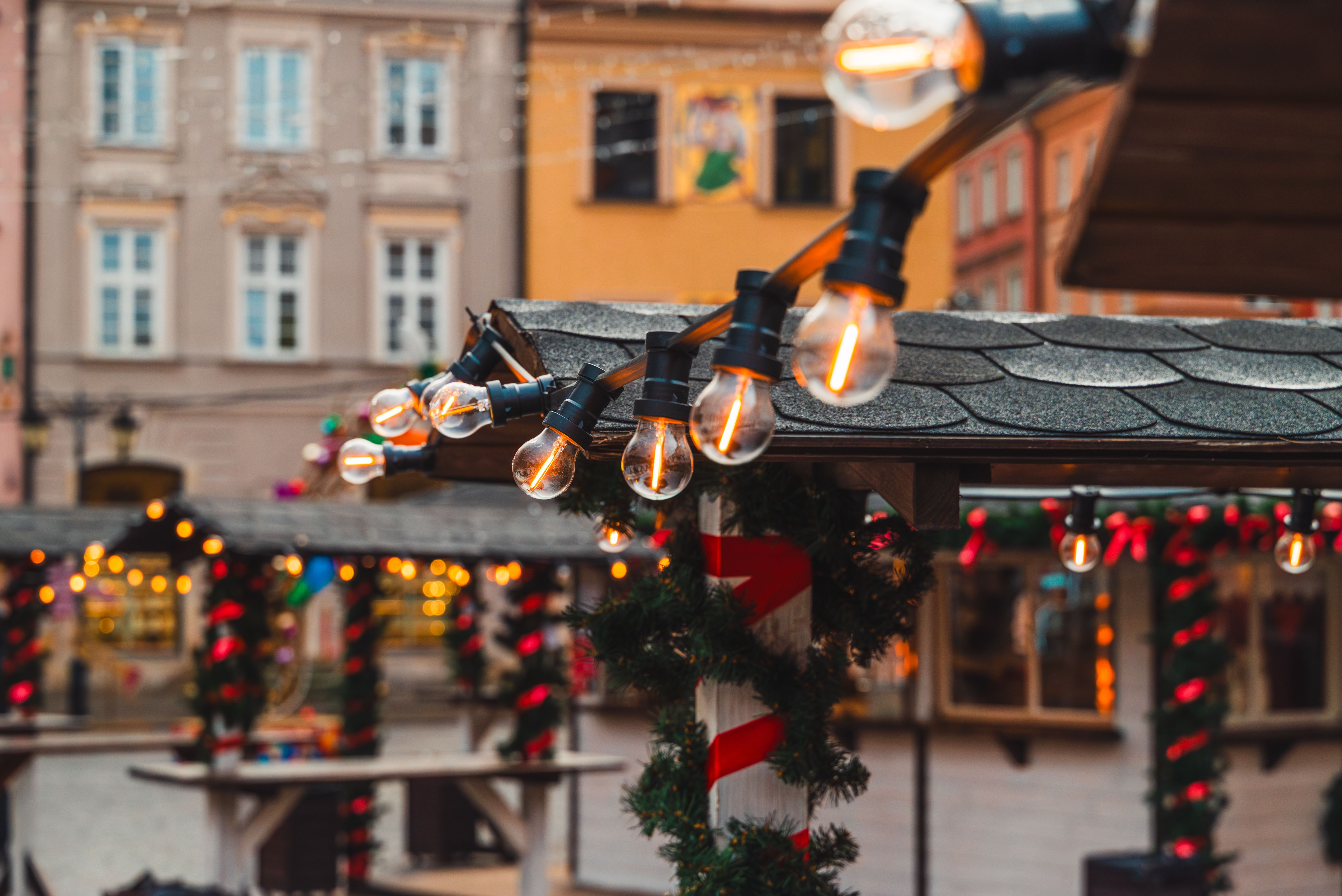 Festive Christmas Market with Warm Outdoor Lighting · Free Stock Photo