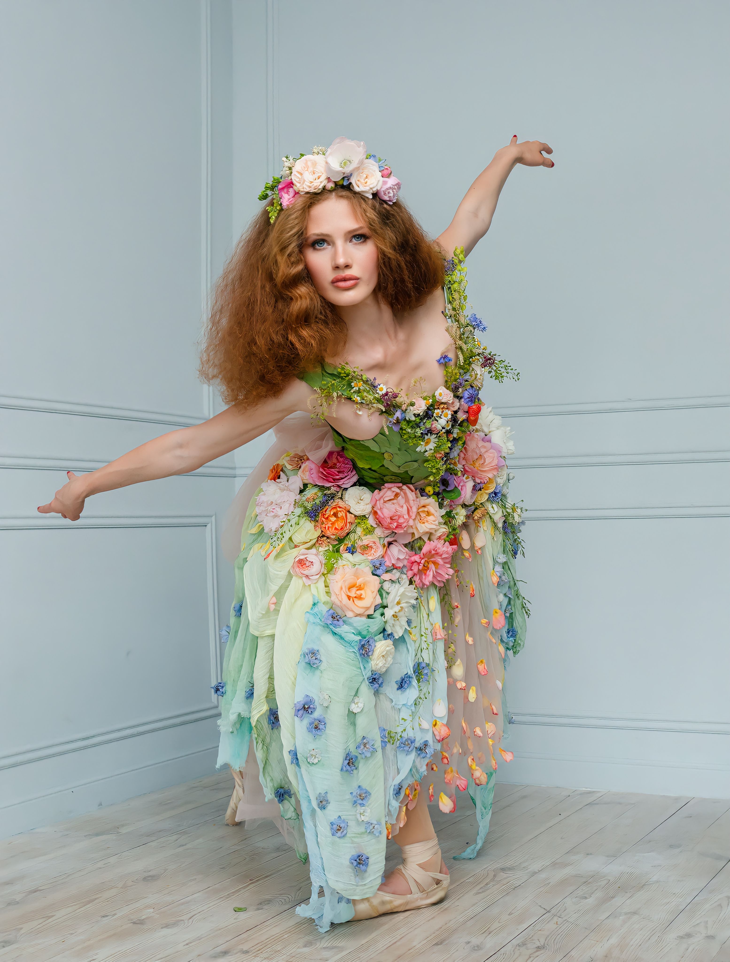 Graceful Dancer in Floral Costume Performing Indoors · Free Stock Photo