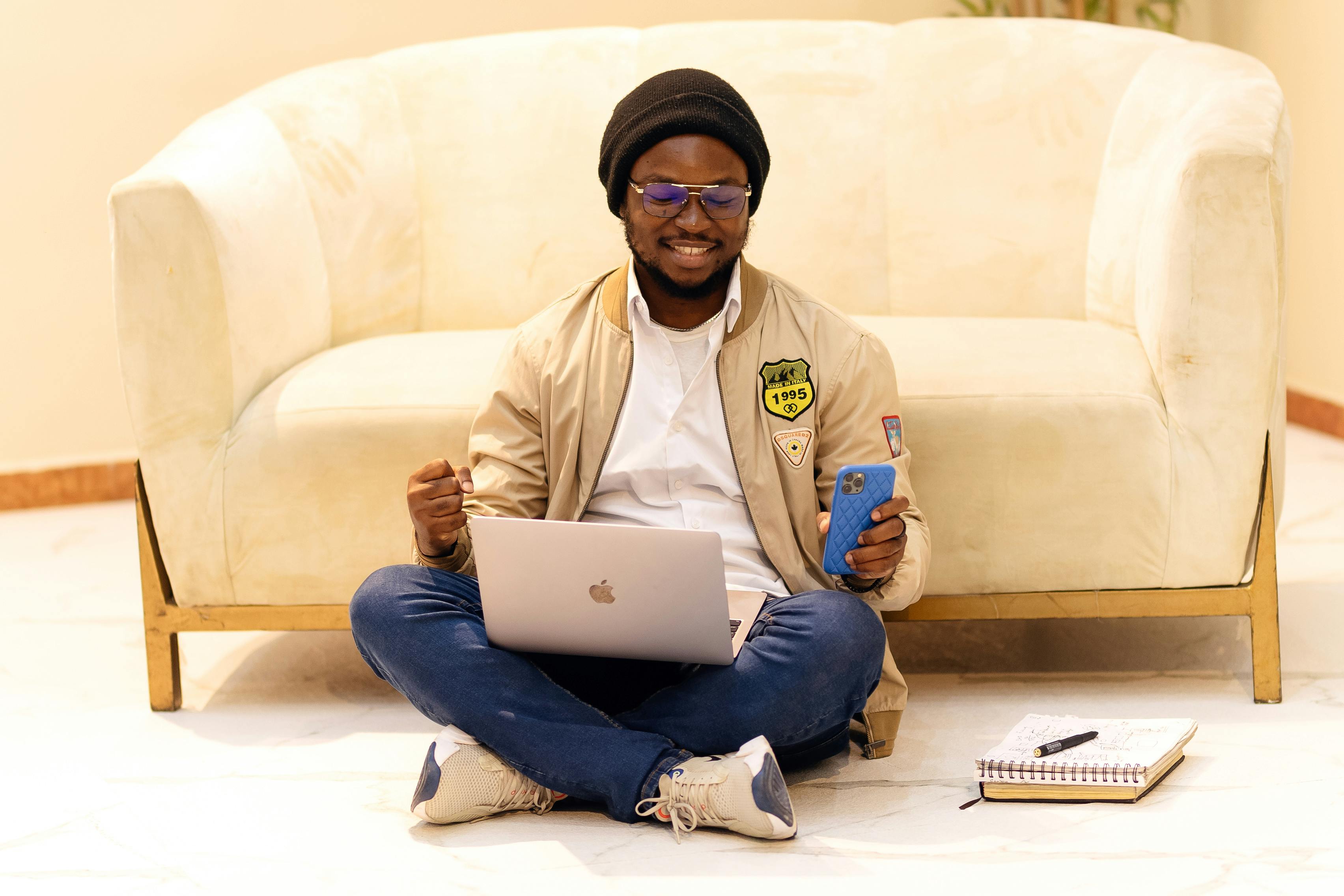 Young Professional Working Remotely with Laptop and Phone · Free Stock ...