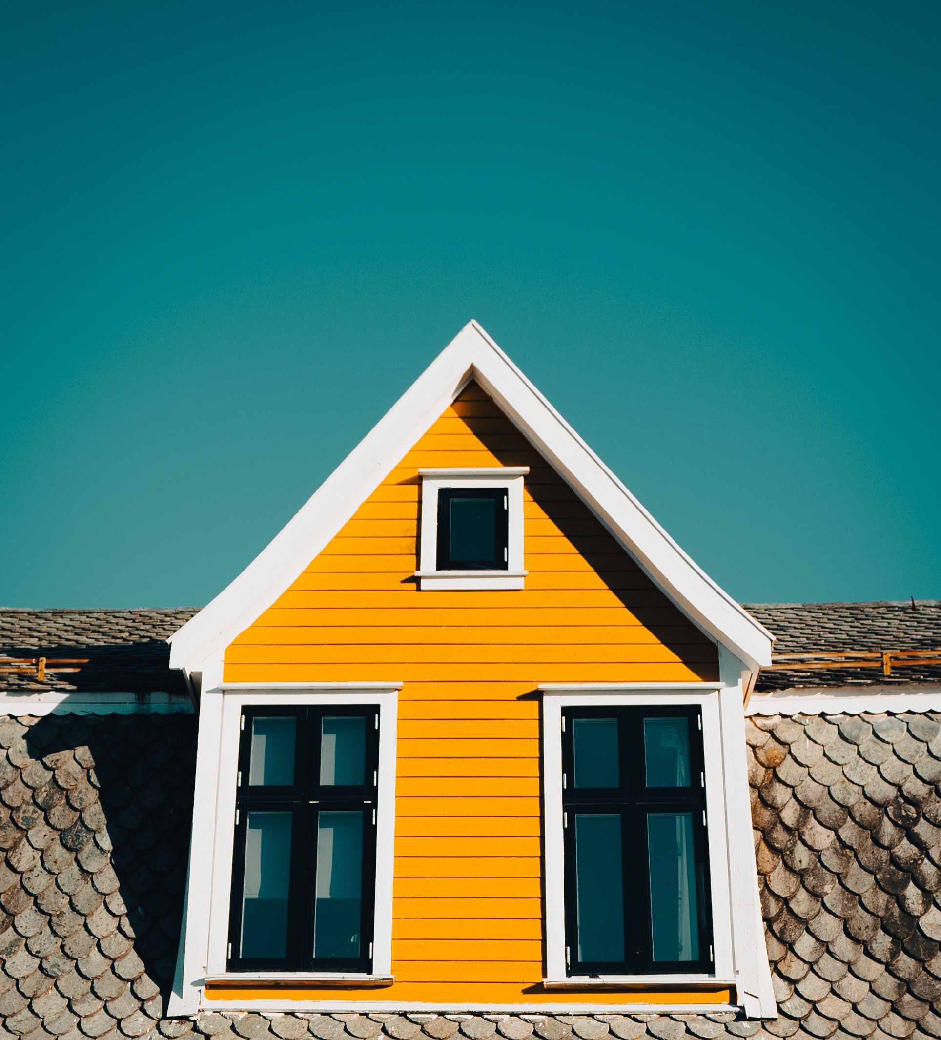 White, Blue, and Yellow House · Free Stock Photo