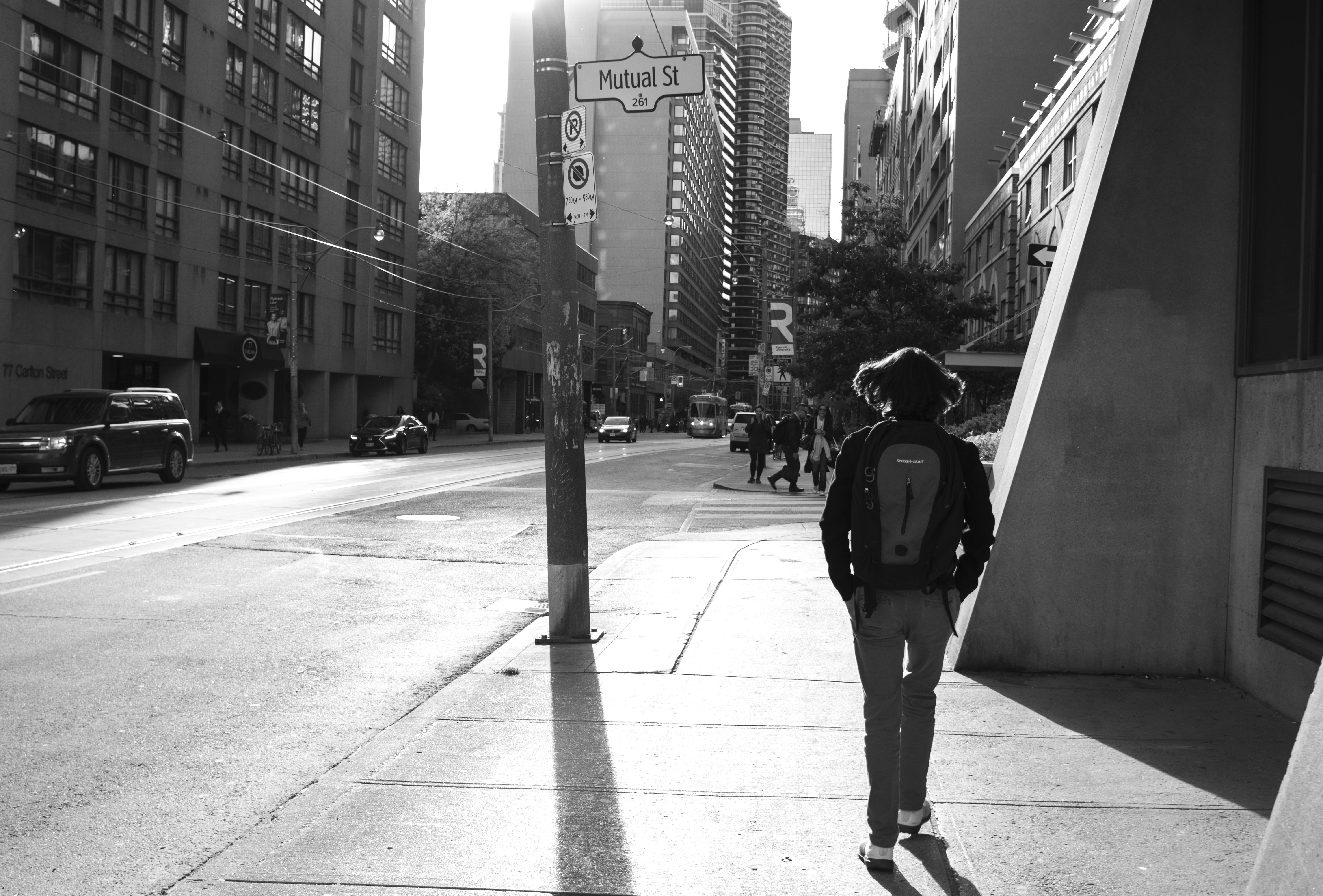 Man Walking Beside Building · Free Stock Photo