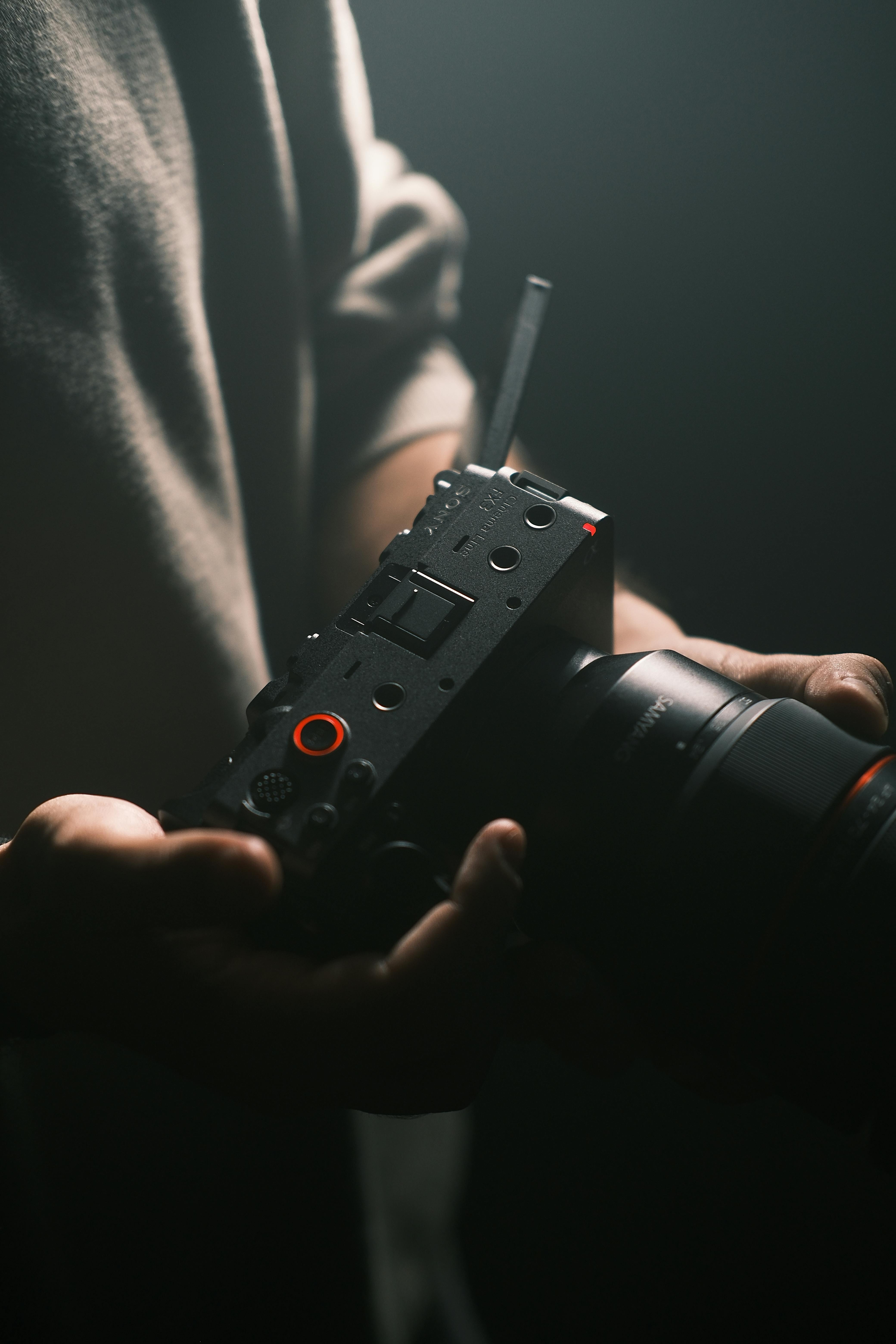 Close-Up of Professional Camera in Hands · Free Stock Photo