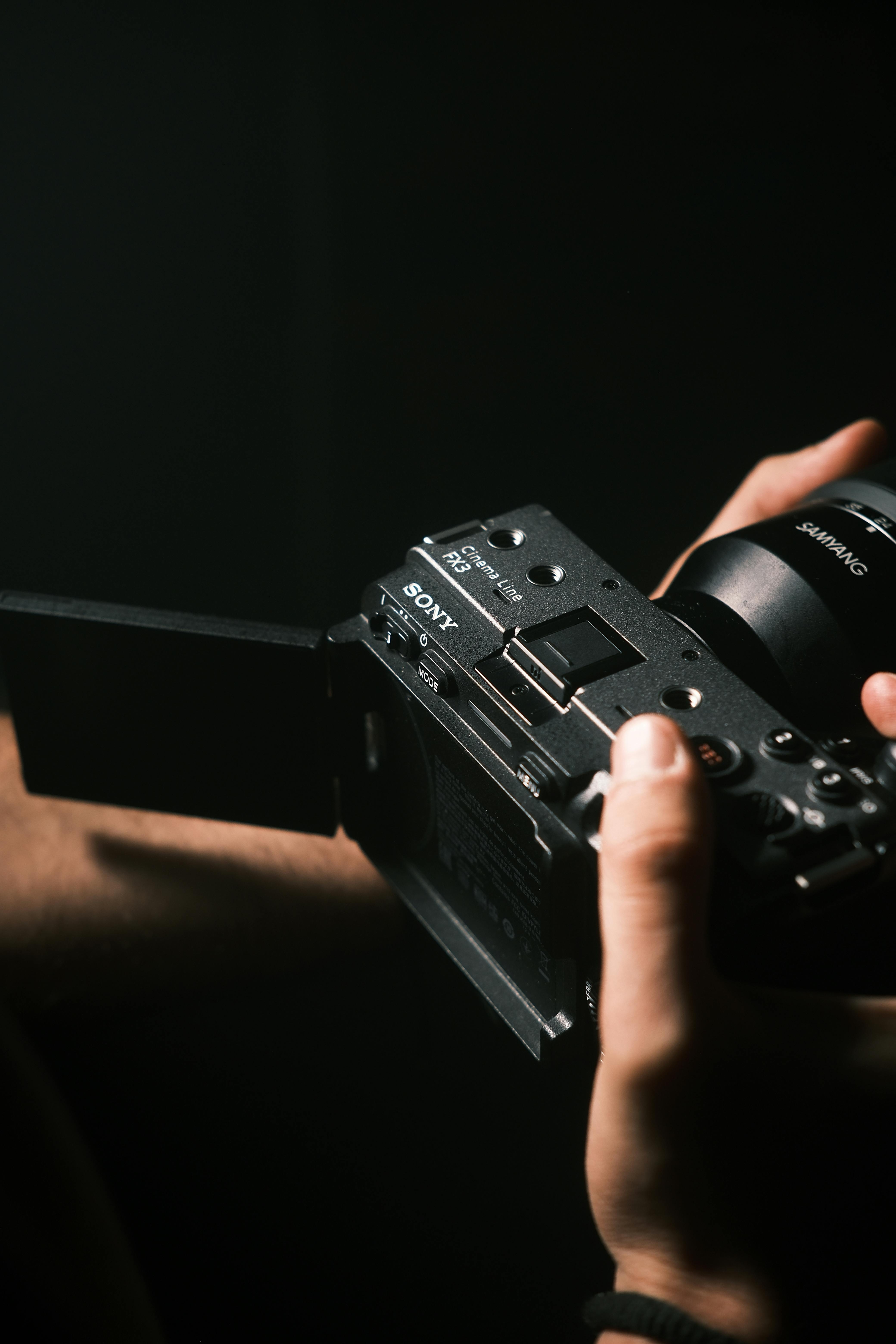 Close-Up of Professional Film Camera Handling · Free Stock Photo