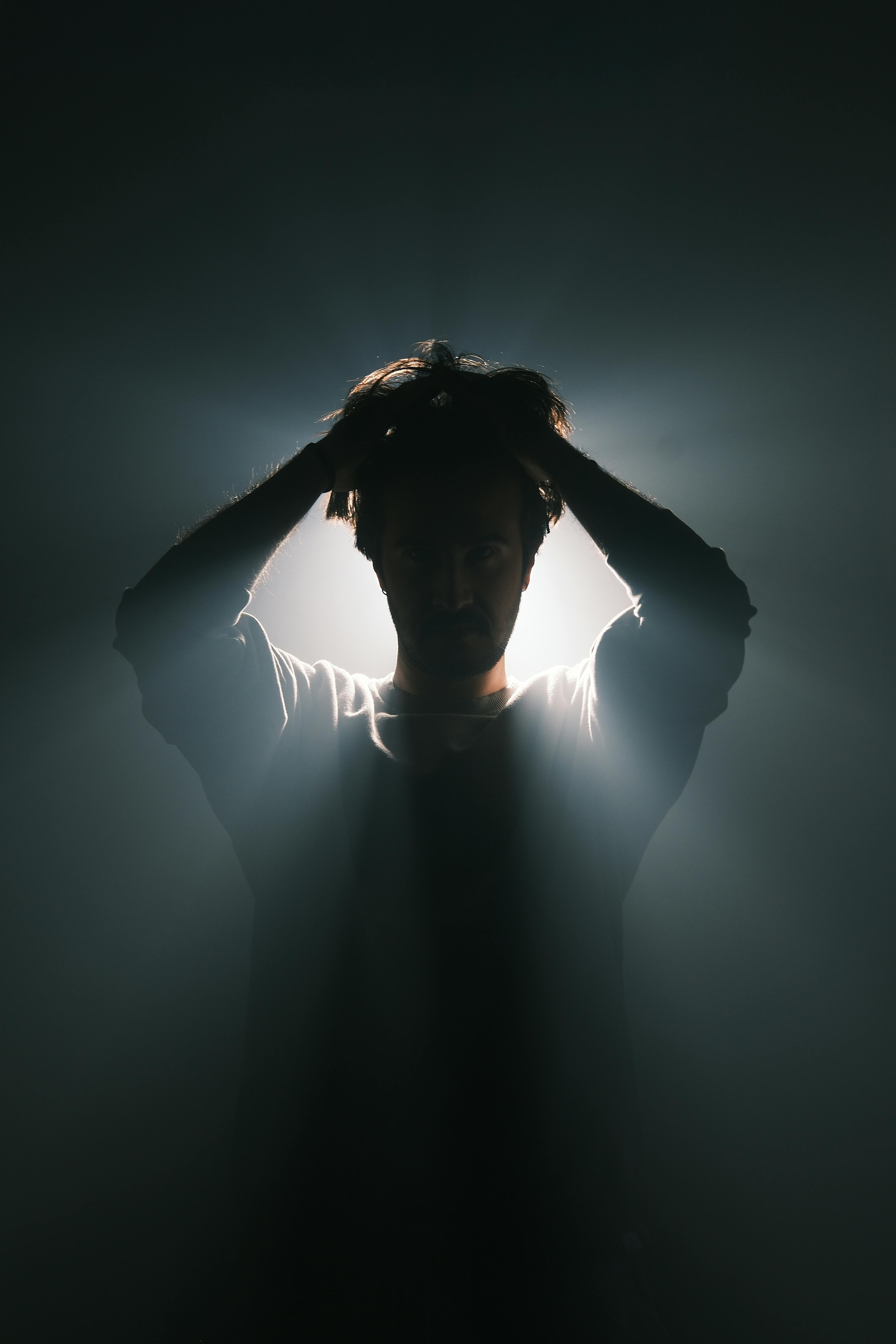 Silhouette of a Person with Dramatic Backlighting · Free Stock Photo