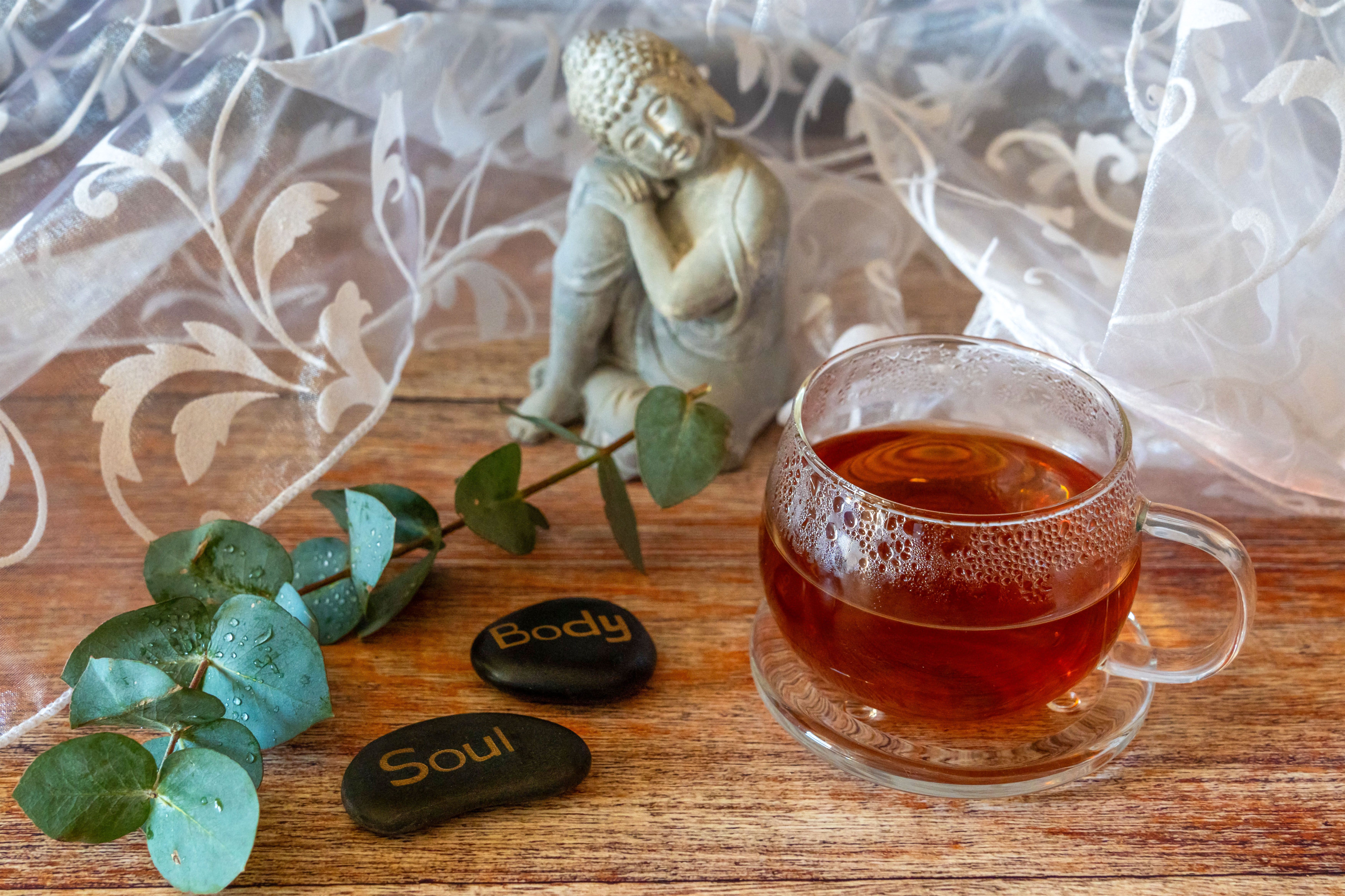 Serene Tea Setup with Buddha and Stones · Free Stock Photo