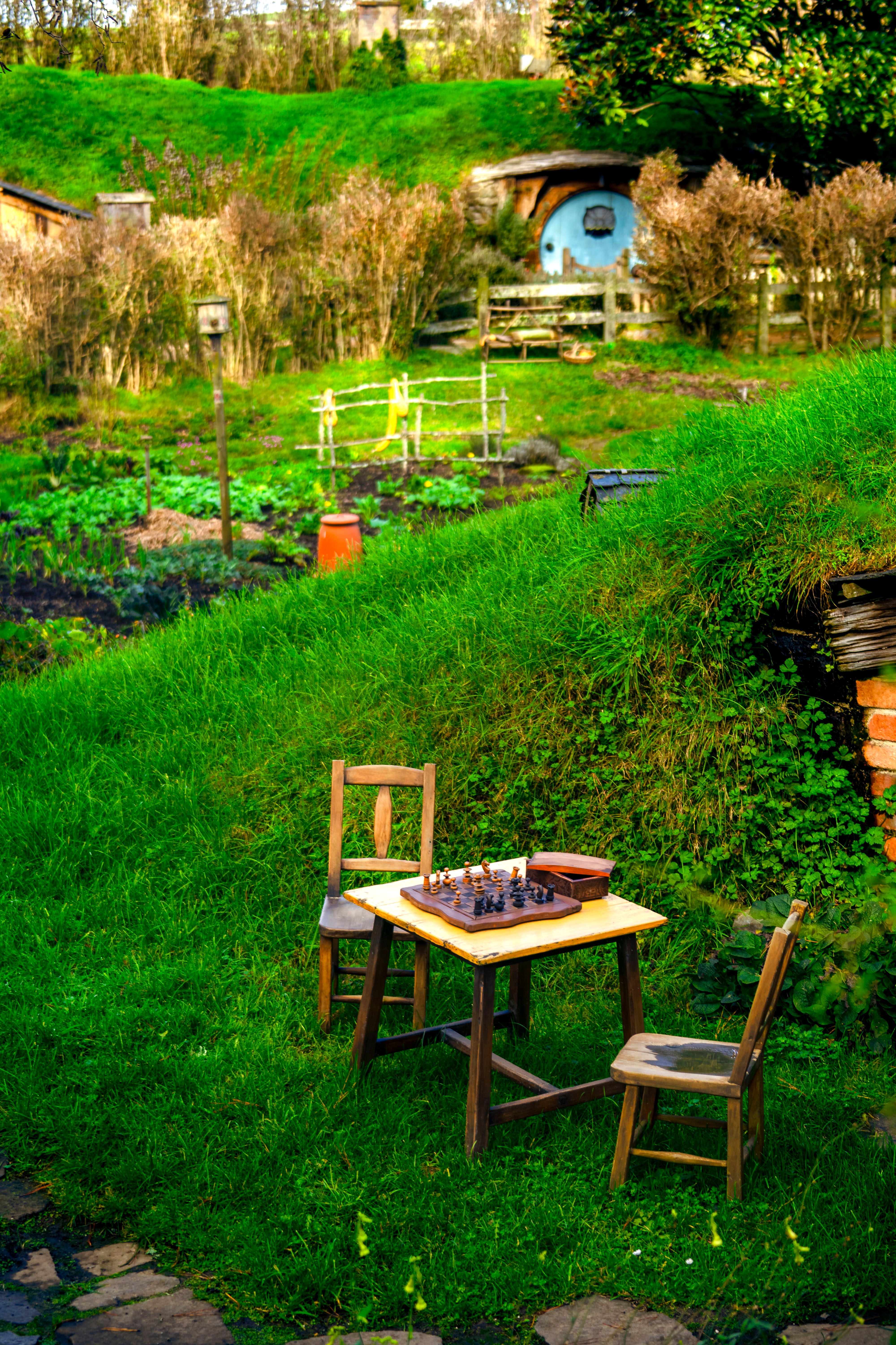 Rustic Chess Set in Hobbiton, New Zealand Garden · Free Stock Photo