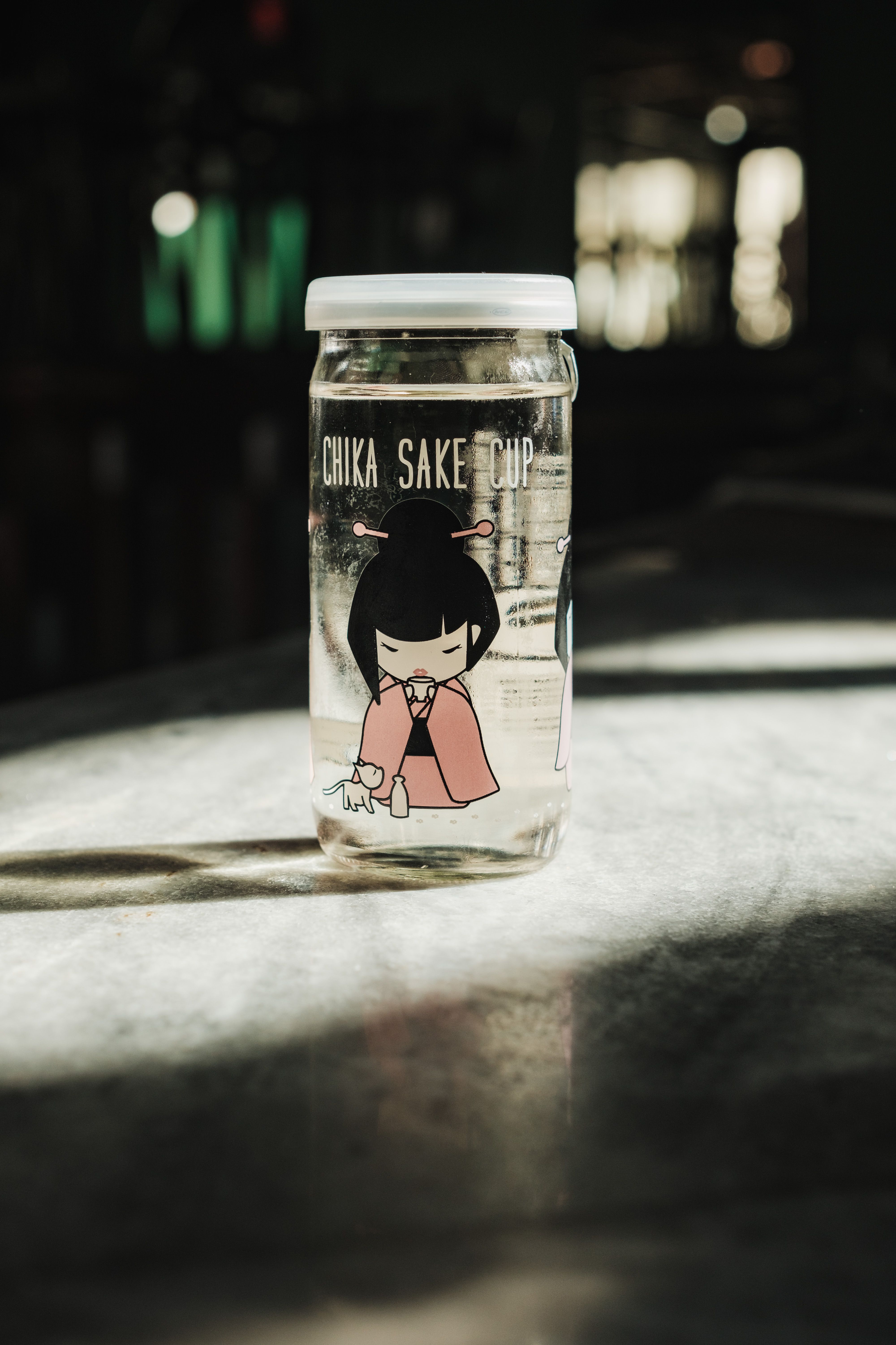 Chika Sake Cup in Sunlit Setting · Free Stock Photo