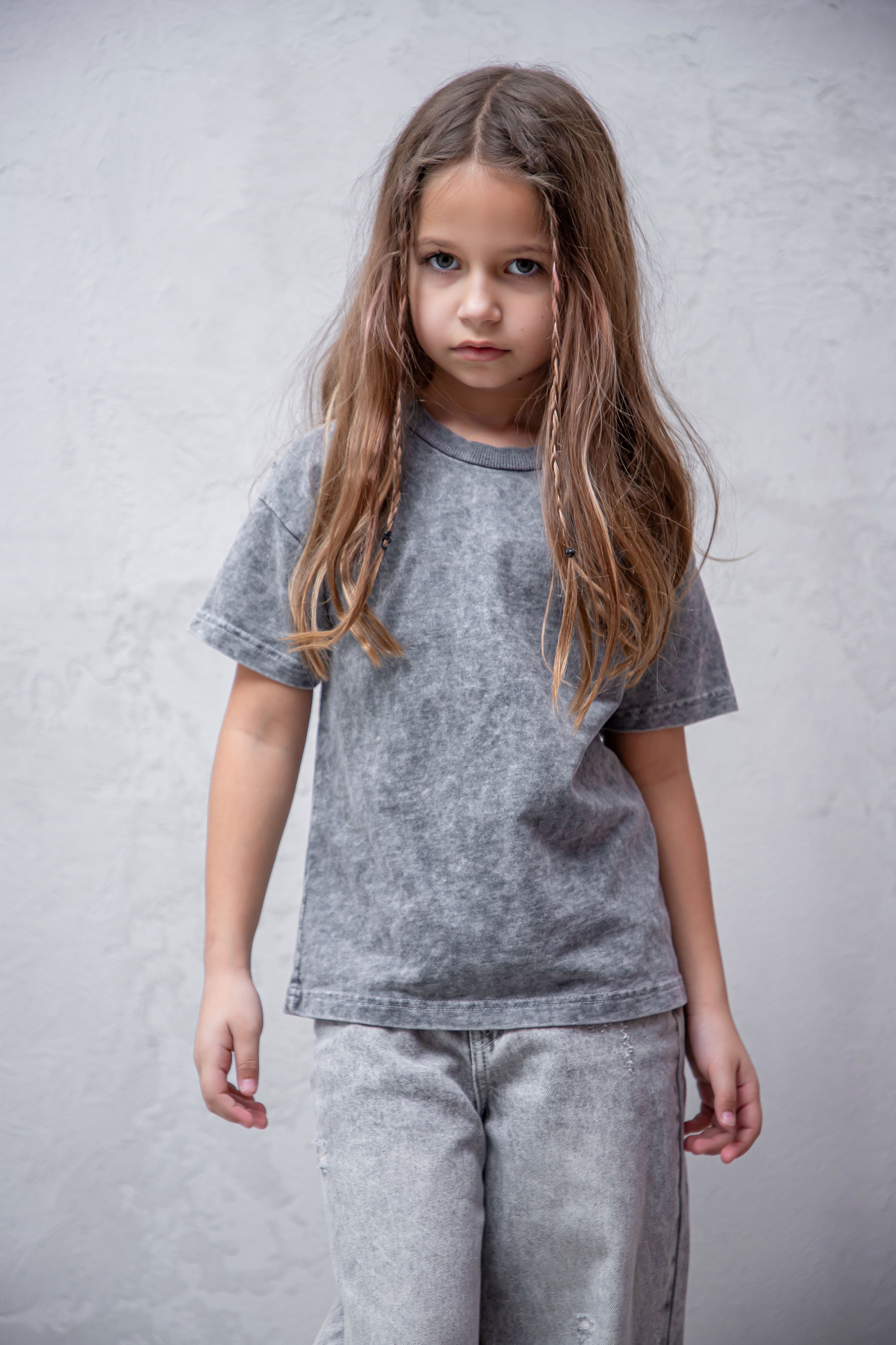 Portrait of a Young Girl in Gray Attire · Free Stock Photo