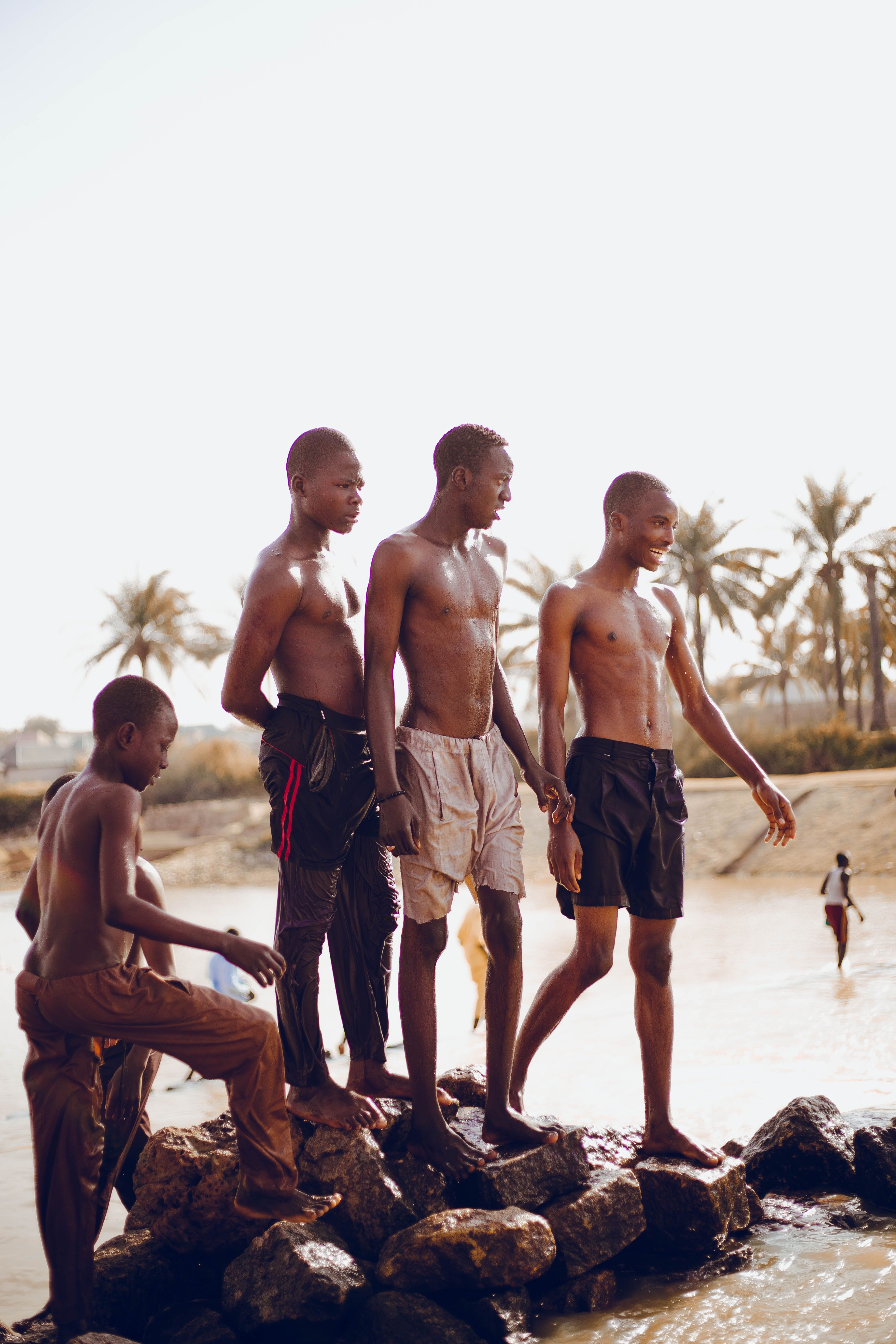 Group of Boys Enjoying a Beach Day Outdoors · Free Stock Photo