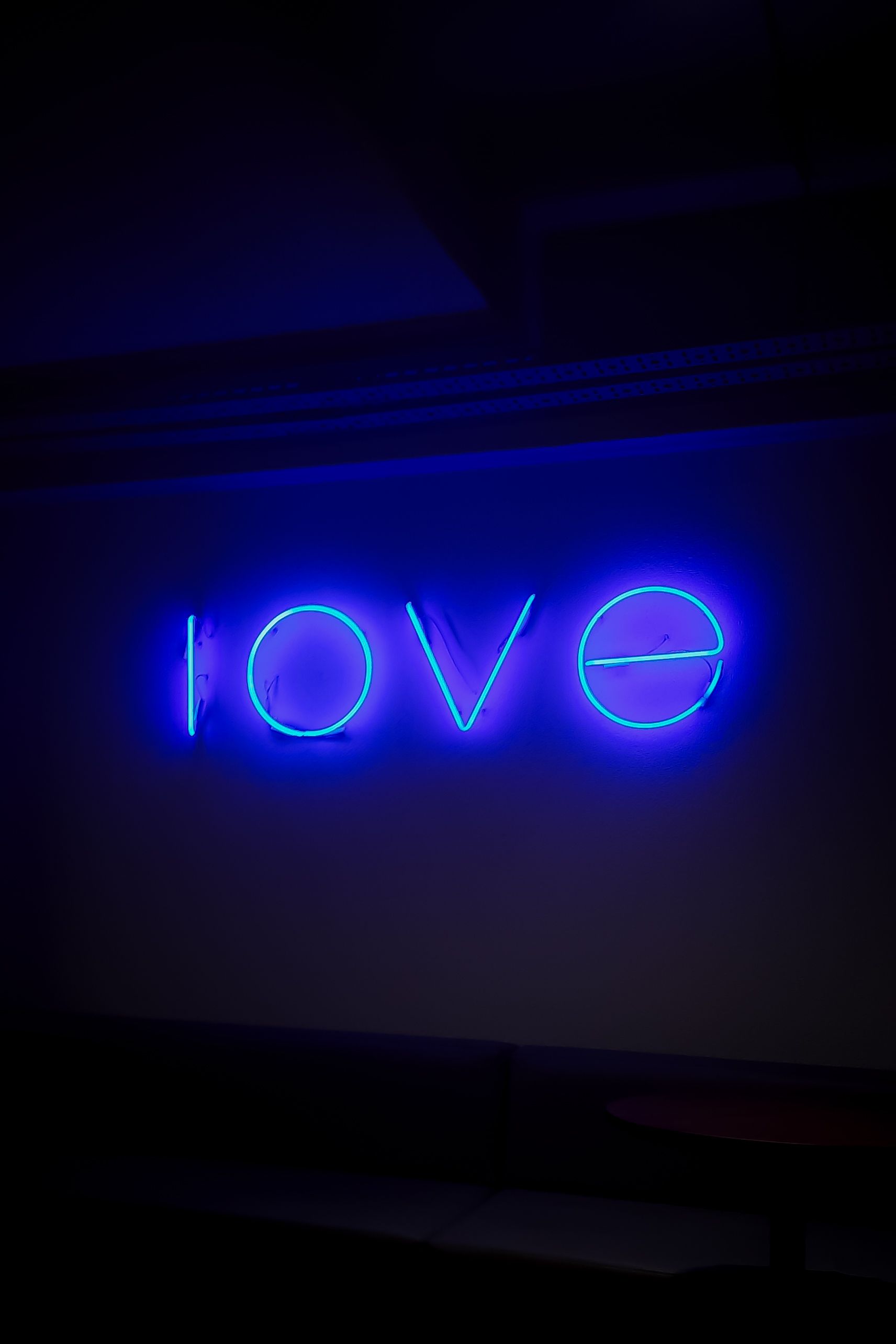 Blue Neon Love Sign in Dark Room · Free Stock Photo
