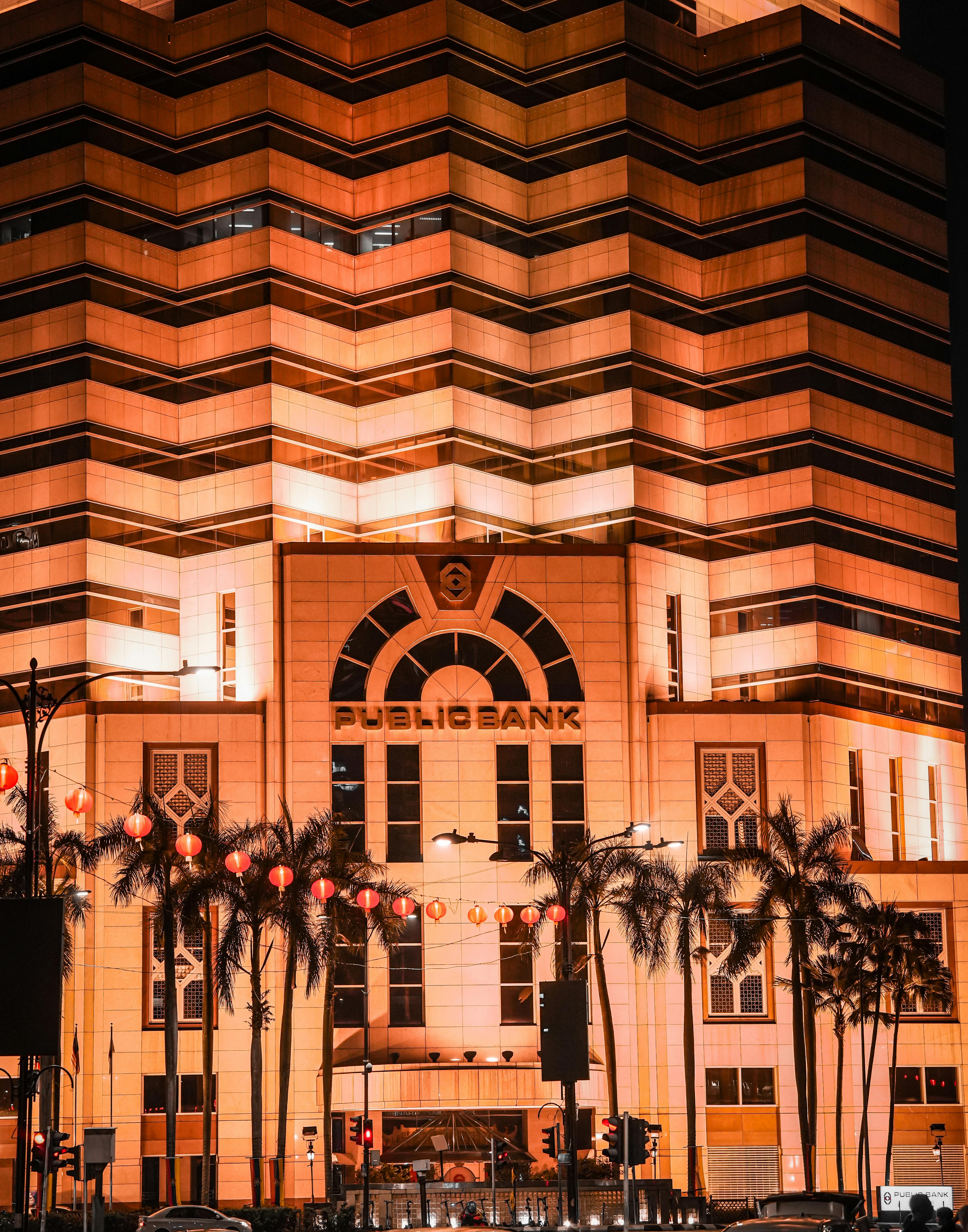 Illuminated Public Bank Building at Night · Free Stock Photo