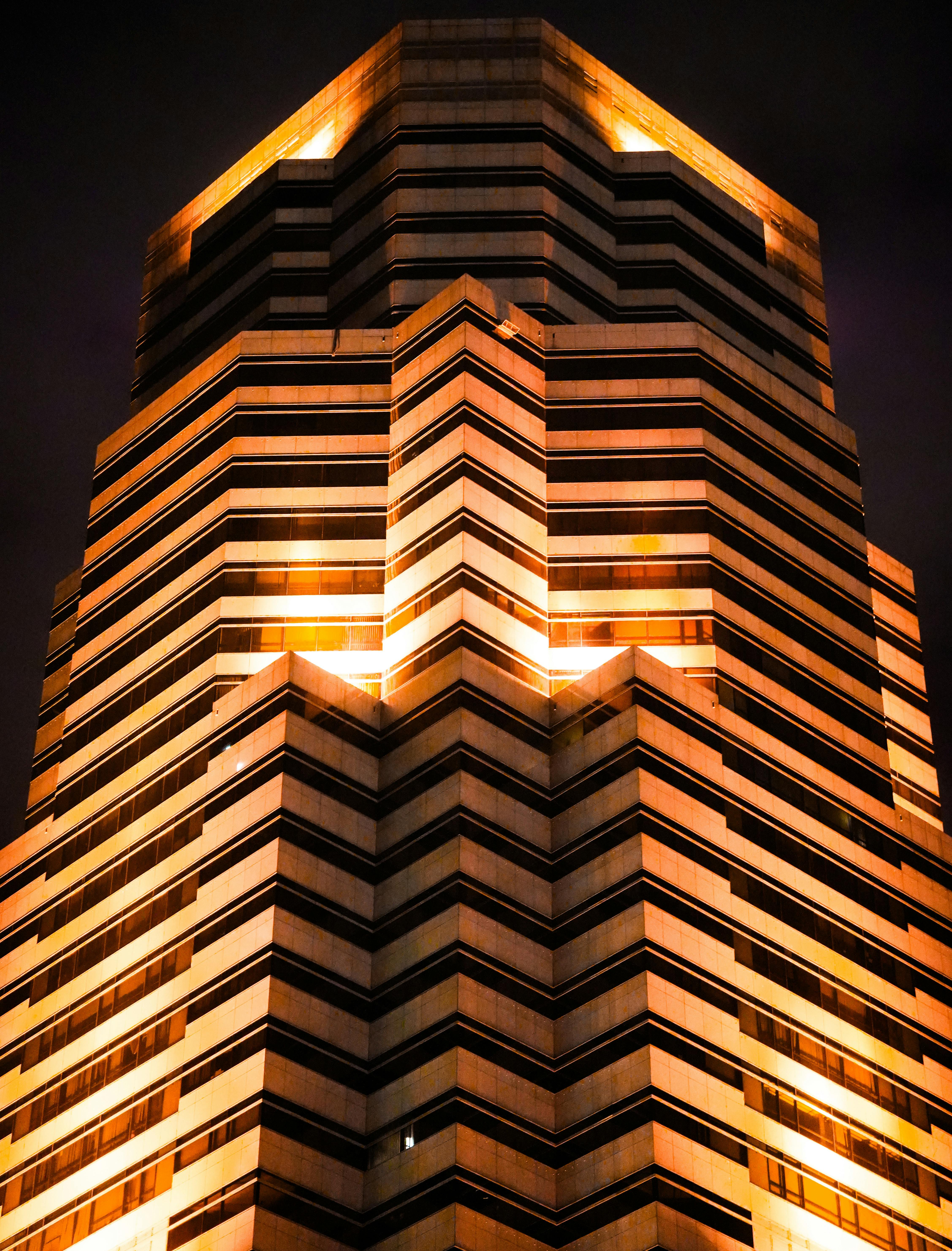 Modern Illuminated Skyscraper at Night · Free Stock Photo