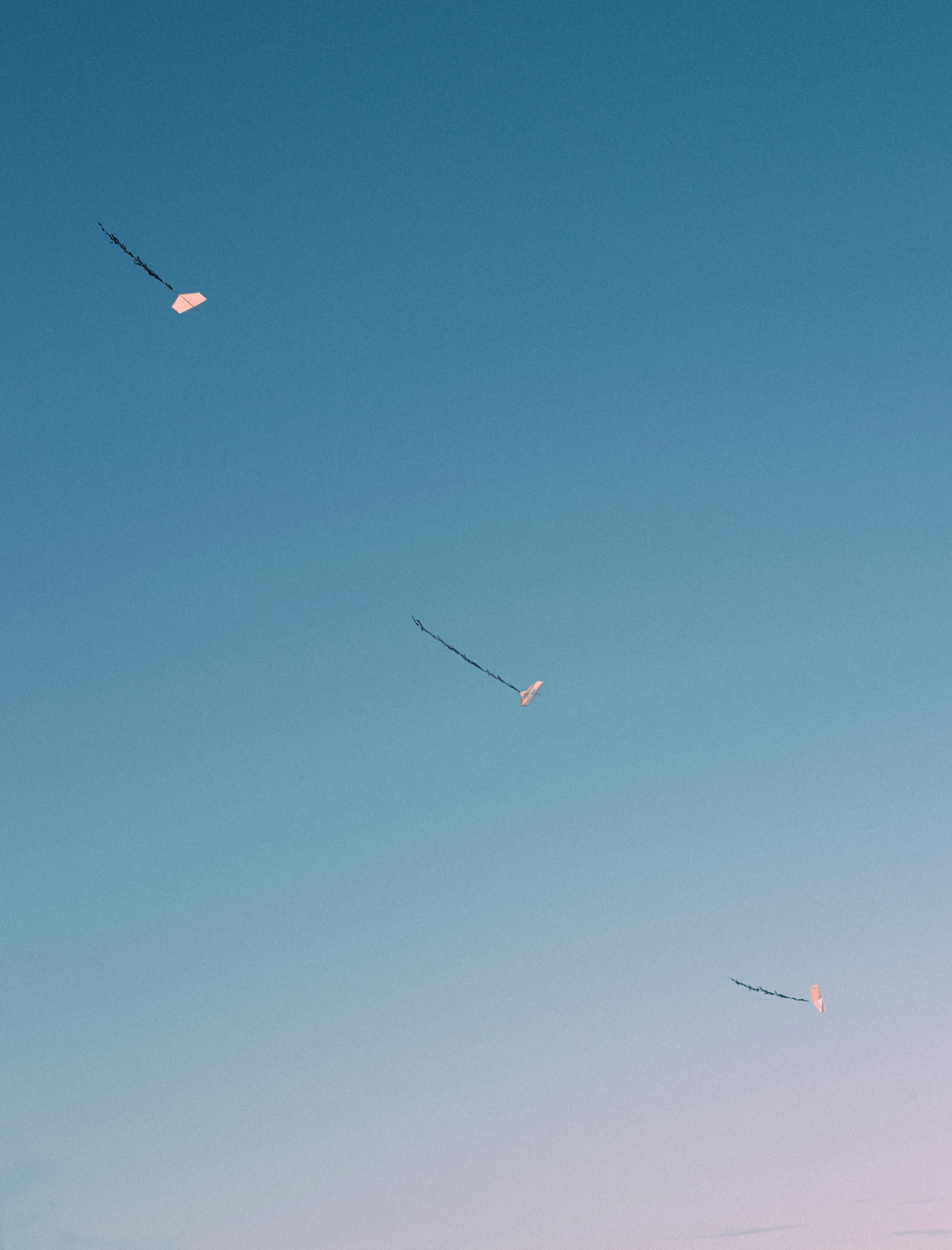 Colorful Kites in Blue Sky Gradient · Free Stock Photo
