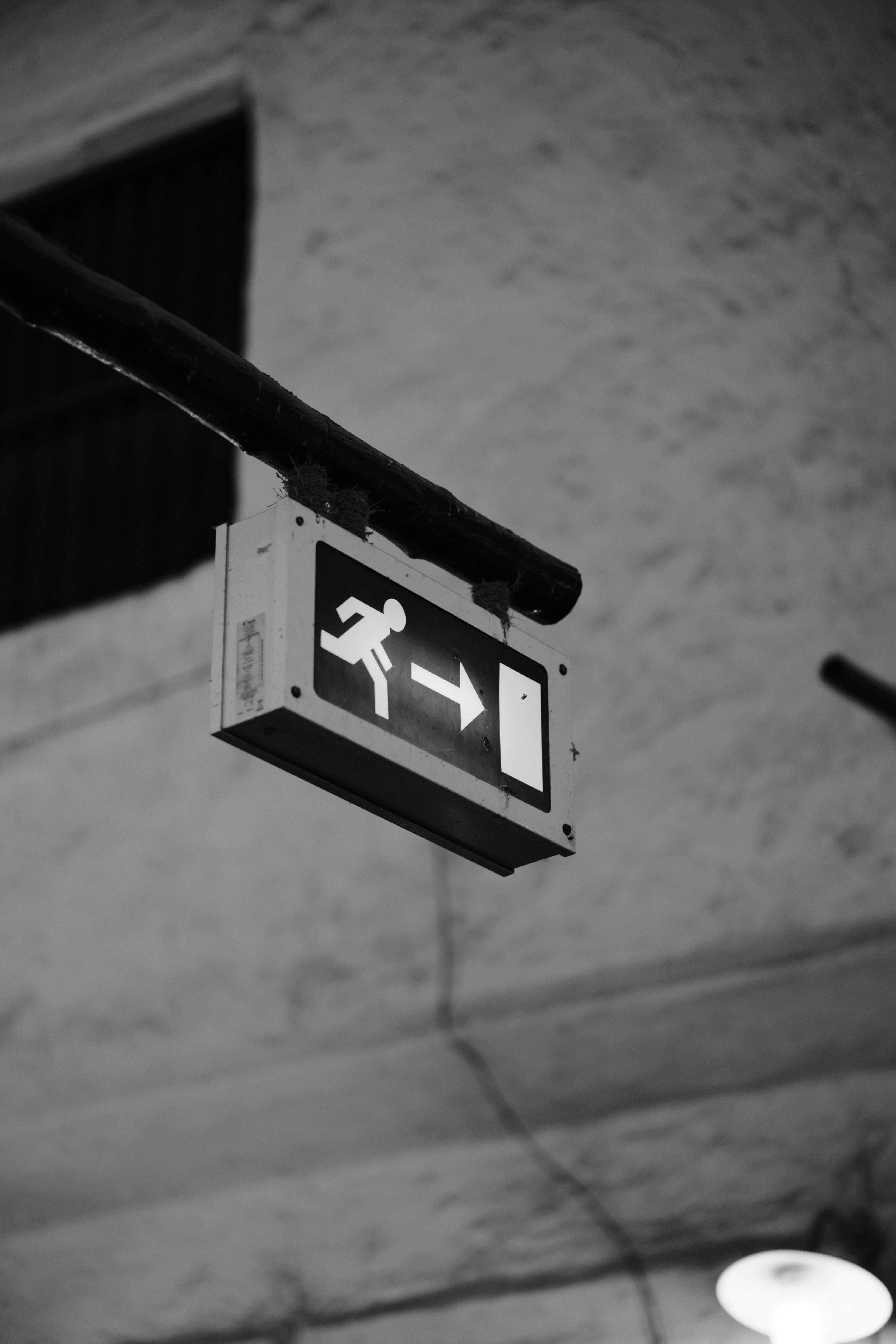Black and White Exit Sign in Qatar Building · Free Stock Photo