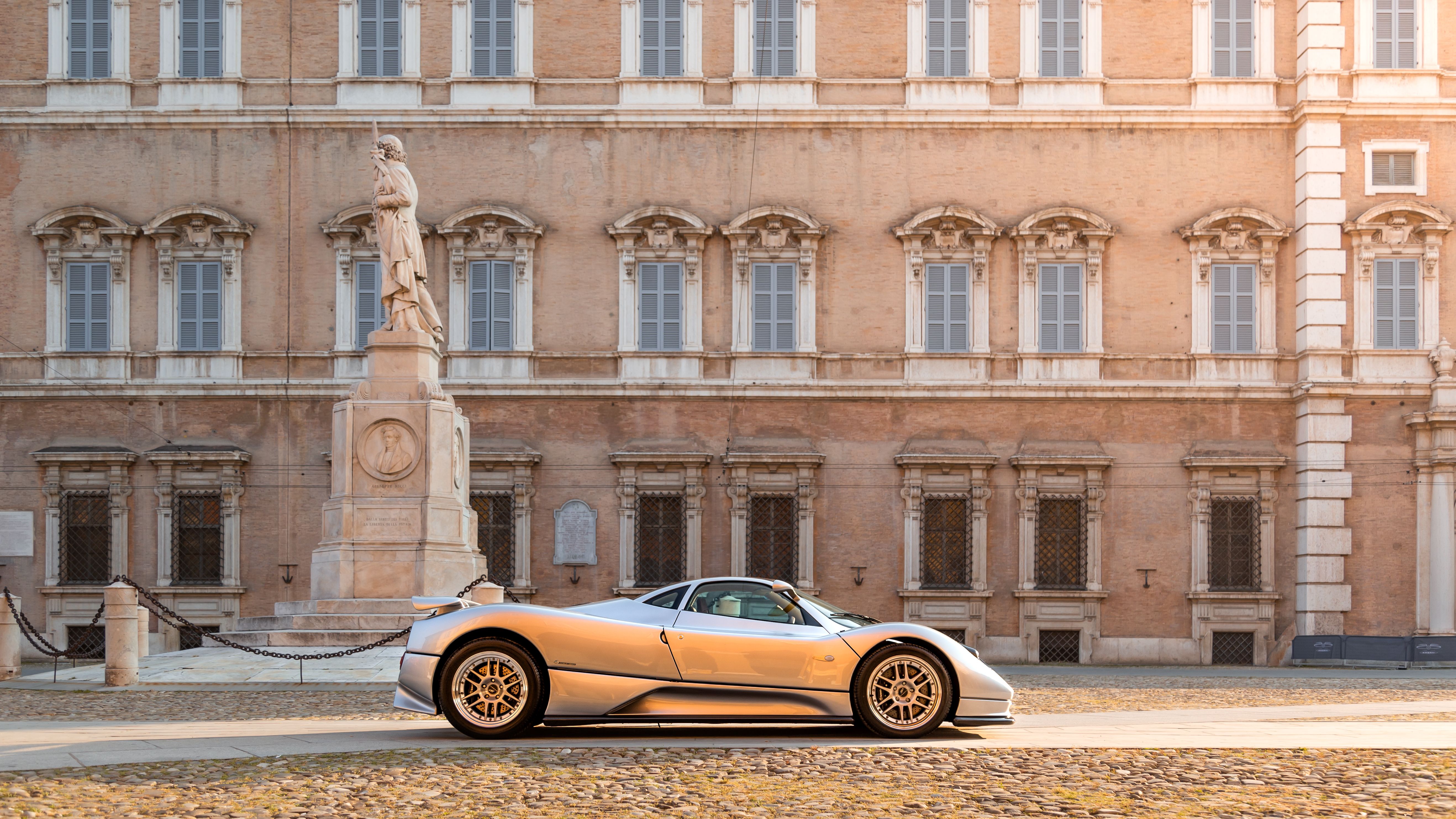 Luxurious Silver Supercar by Historic Building · Free Stock Photo