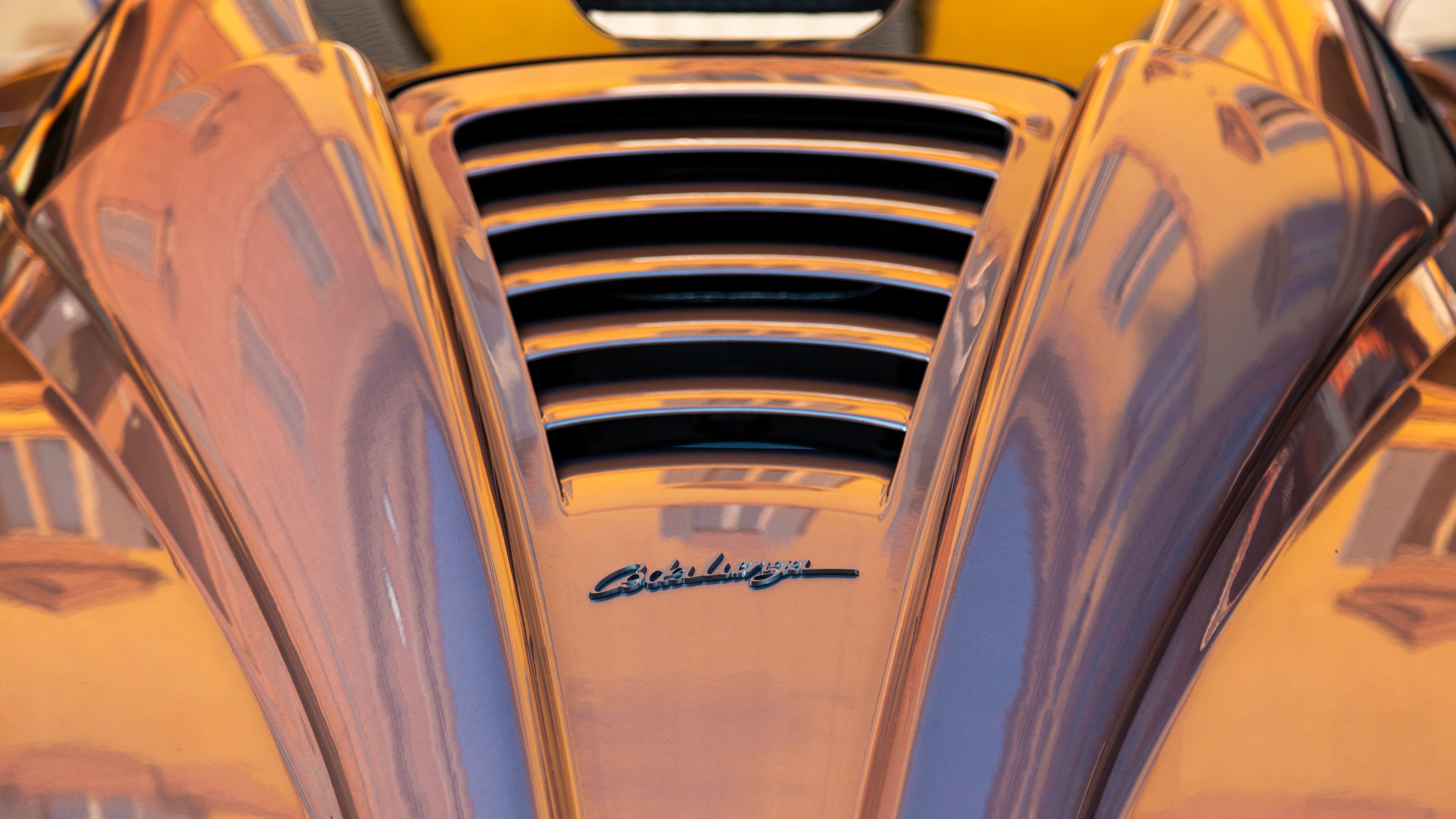 Close-up of Luxury Car Engine Cover with Reflections · Free Stock Photo