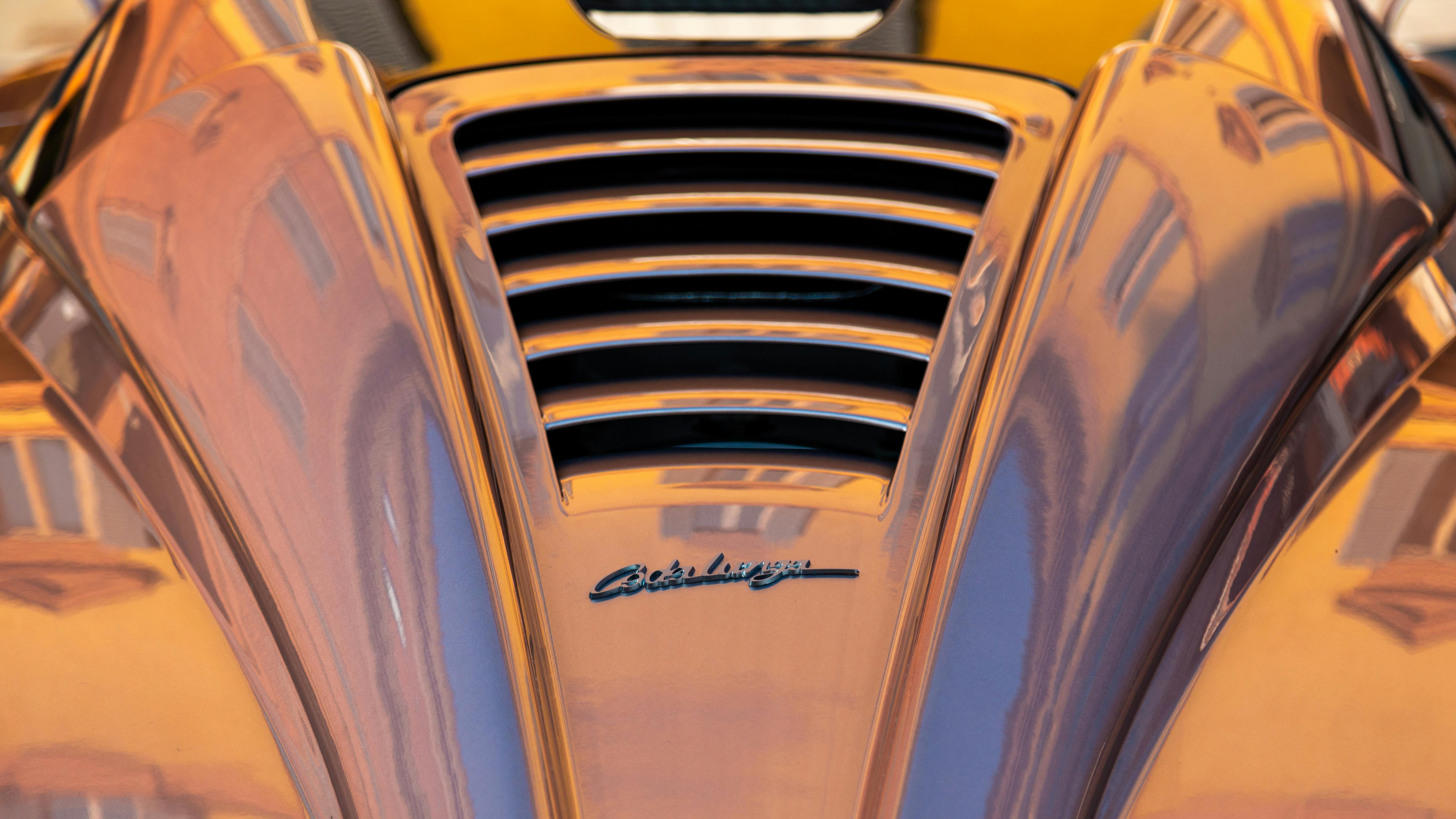 Close-up of Luxury Car Engine Cover with Reflections · Free Stock Photo