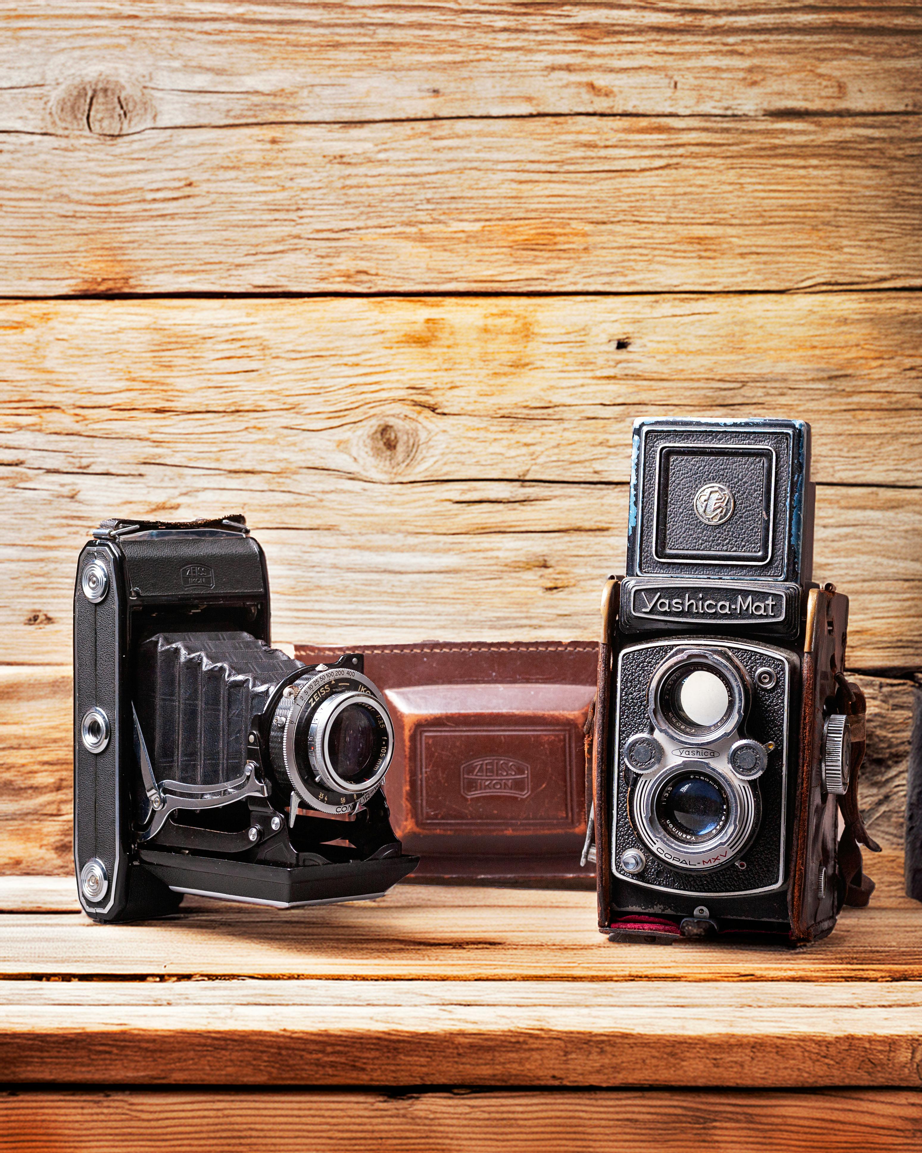 Camera and a Leather Case on a Bench · Free Stock Photo