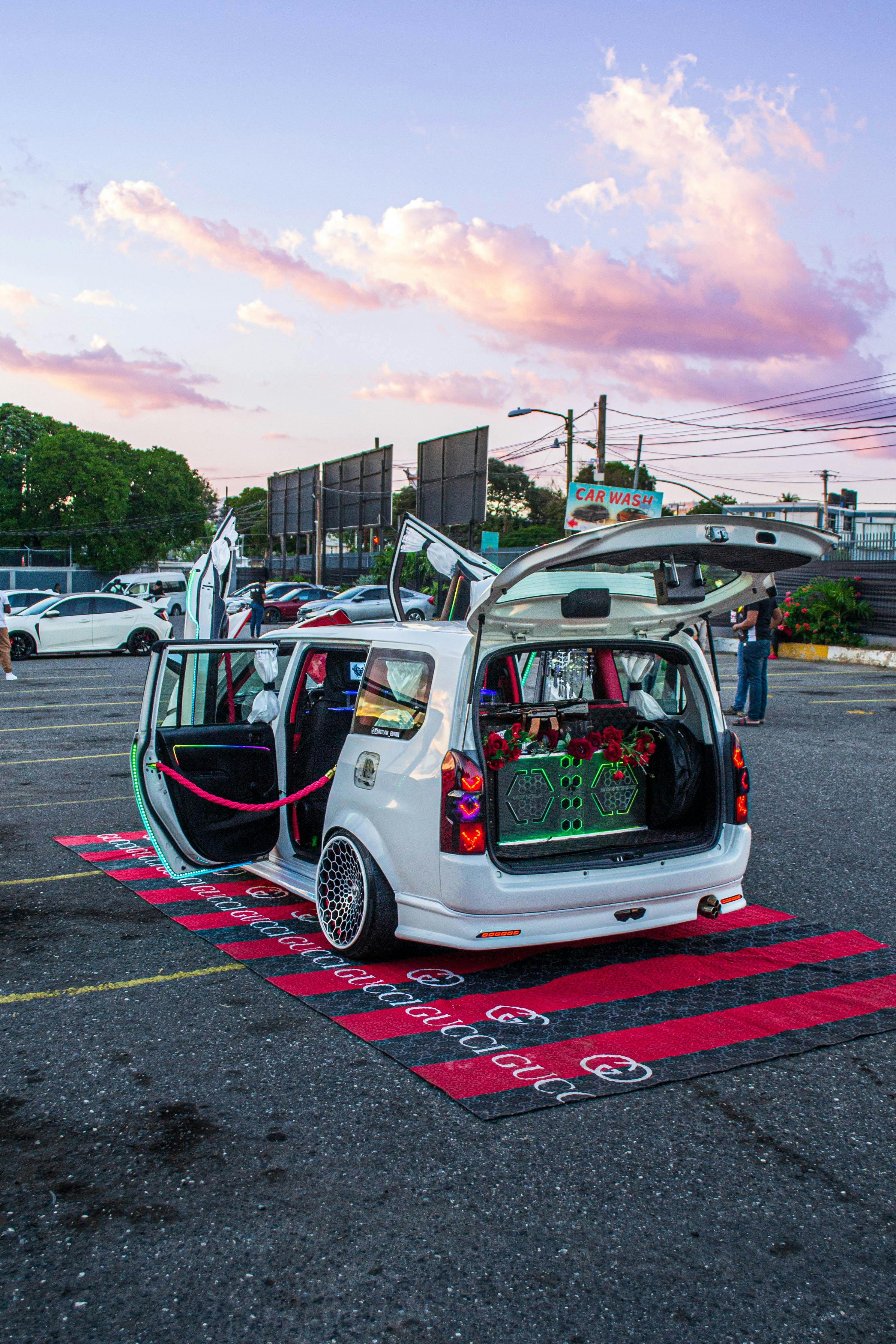 Modified Car with Custom Sound System at Sunset · Free Stock Photo