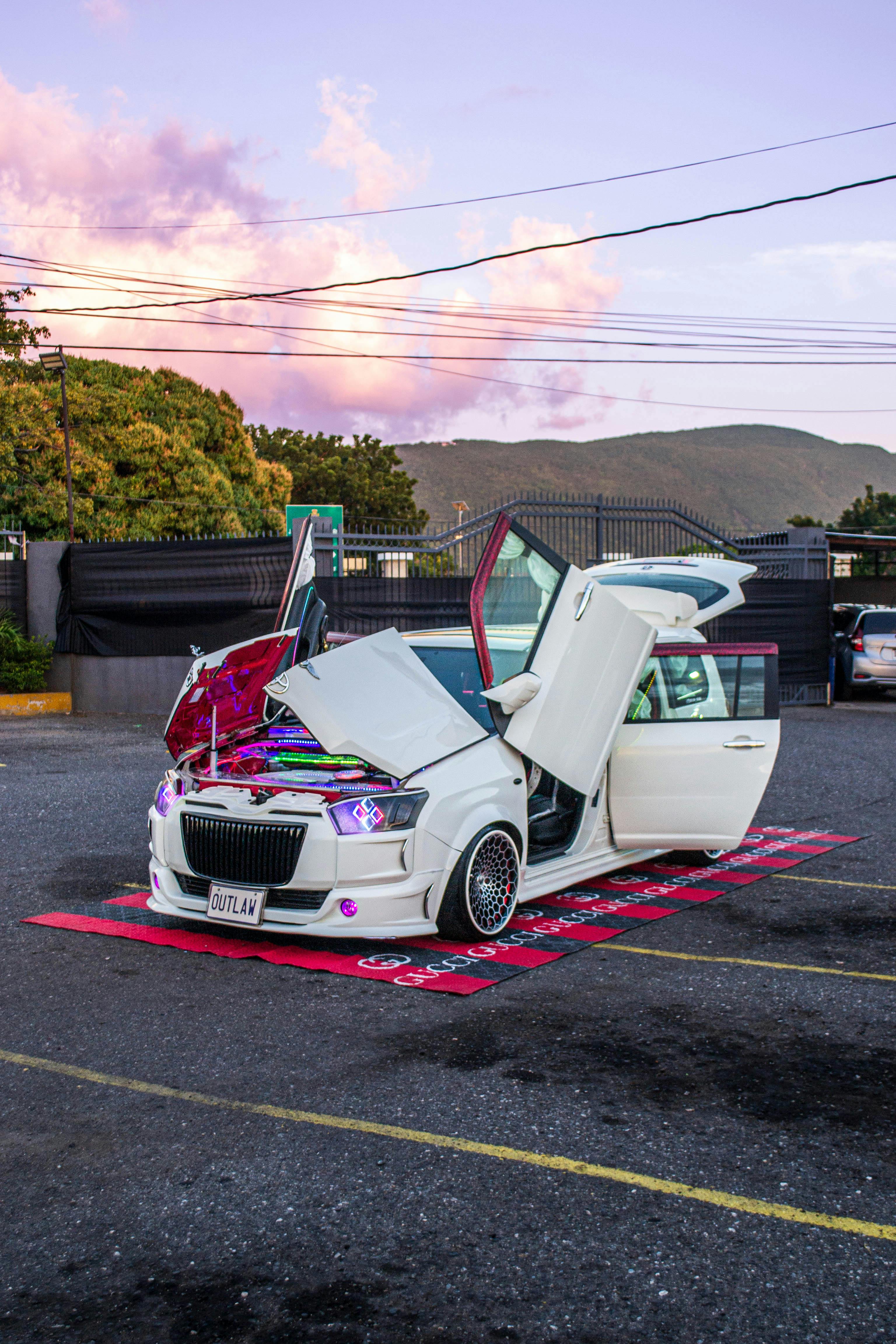 Modified Car with Open Doors at Sunset · Free Stock Photo