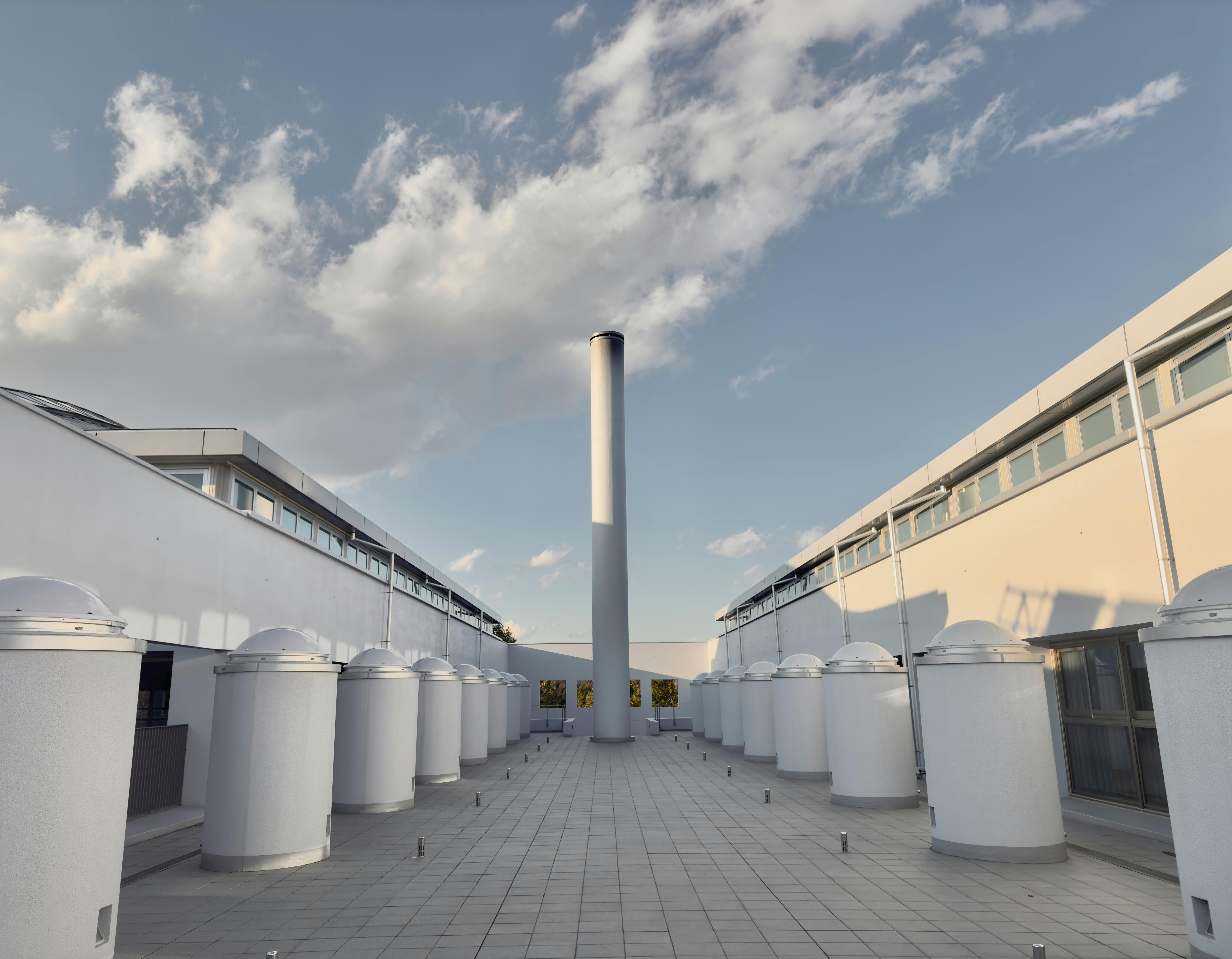 Modern Architectural Rooftop with Cylinders · Free Stock Photo