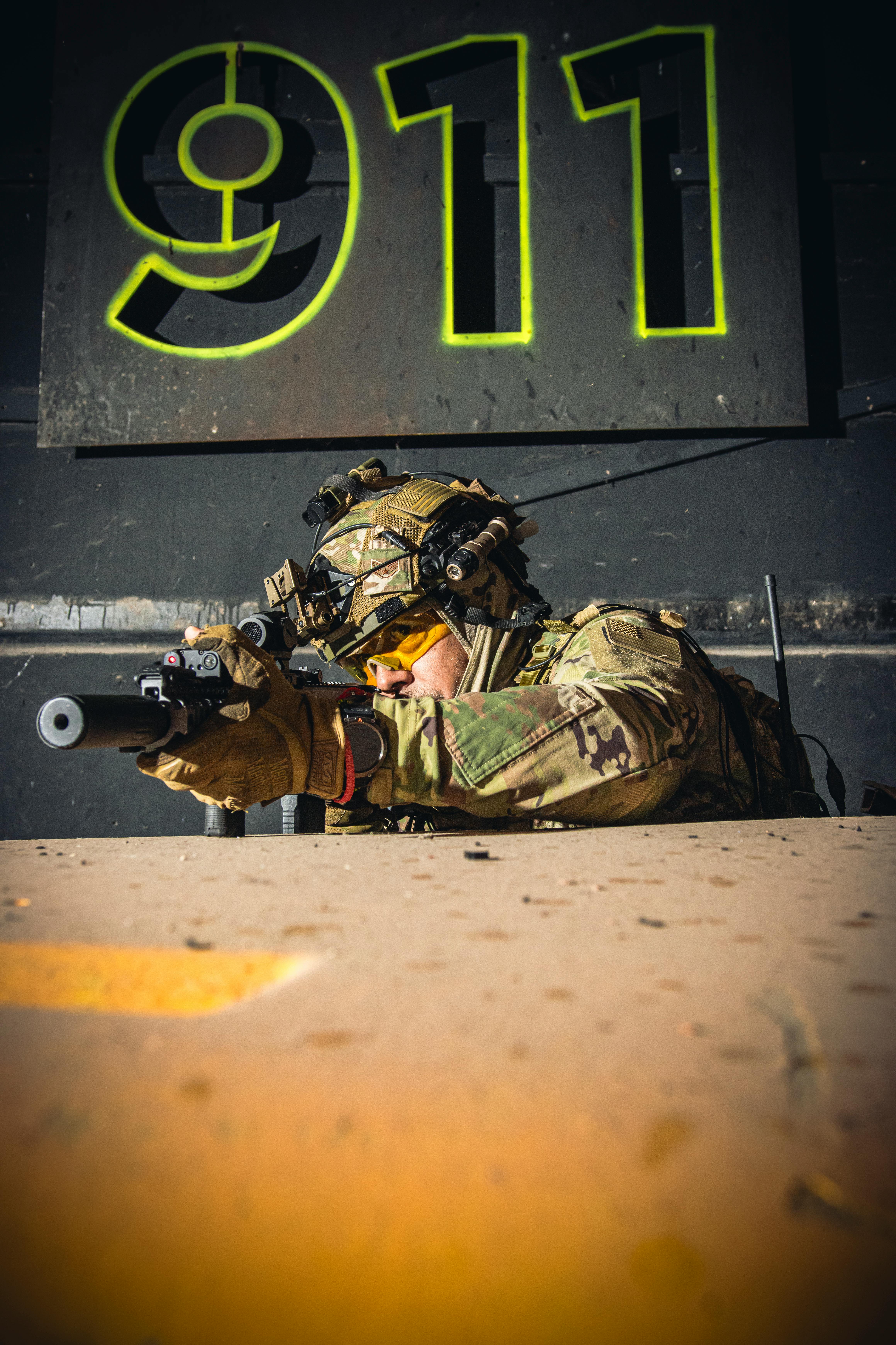 Soldier Man With Black Rifle Sliding on Cliff · Free Stock Photo