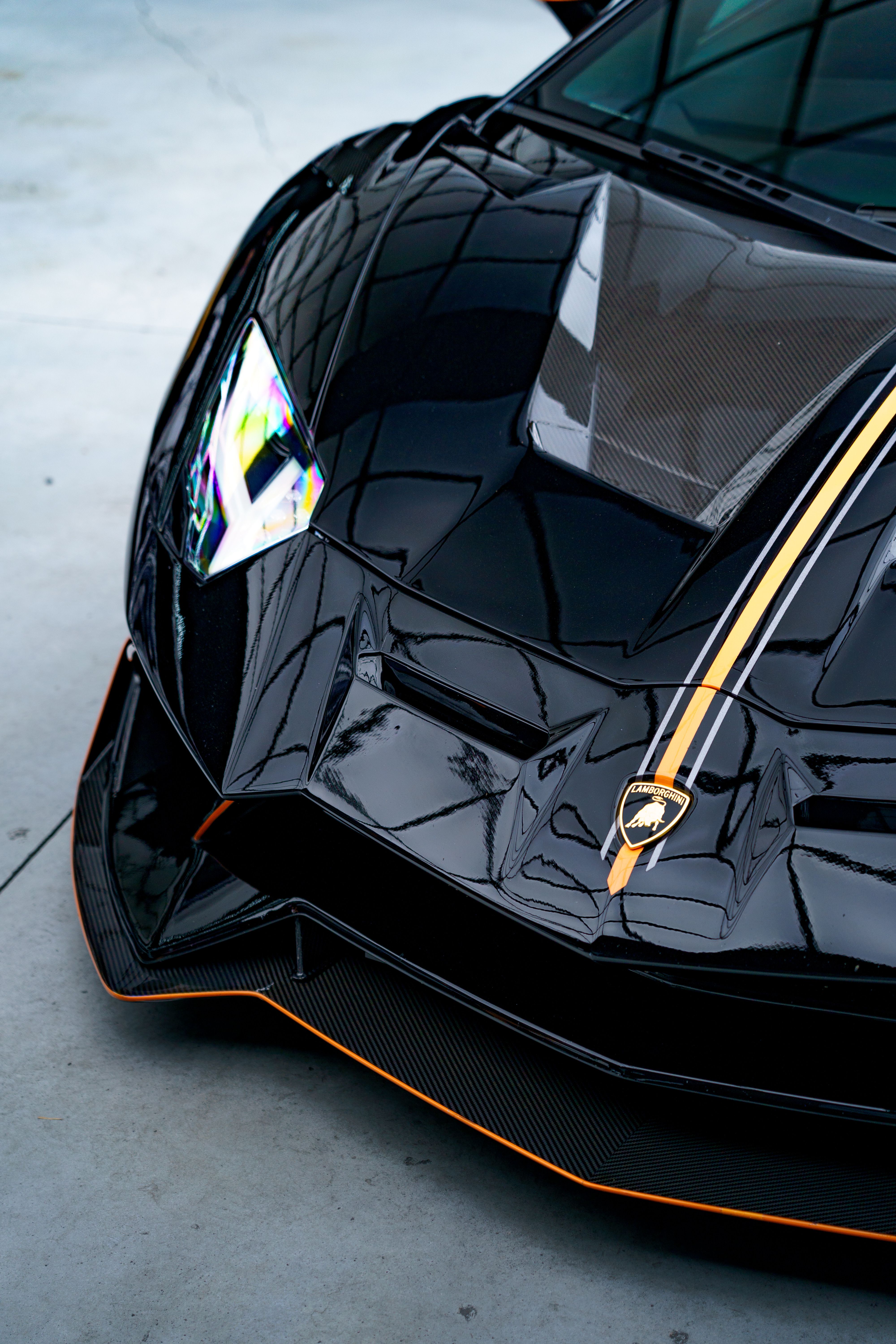 Close-Up of Luxurious Black Sports Car Hood · Free Stock Photo