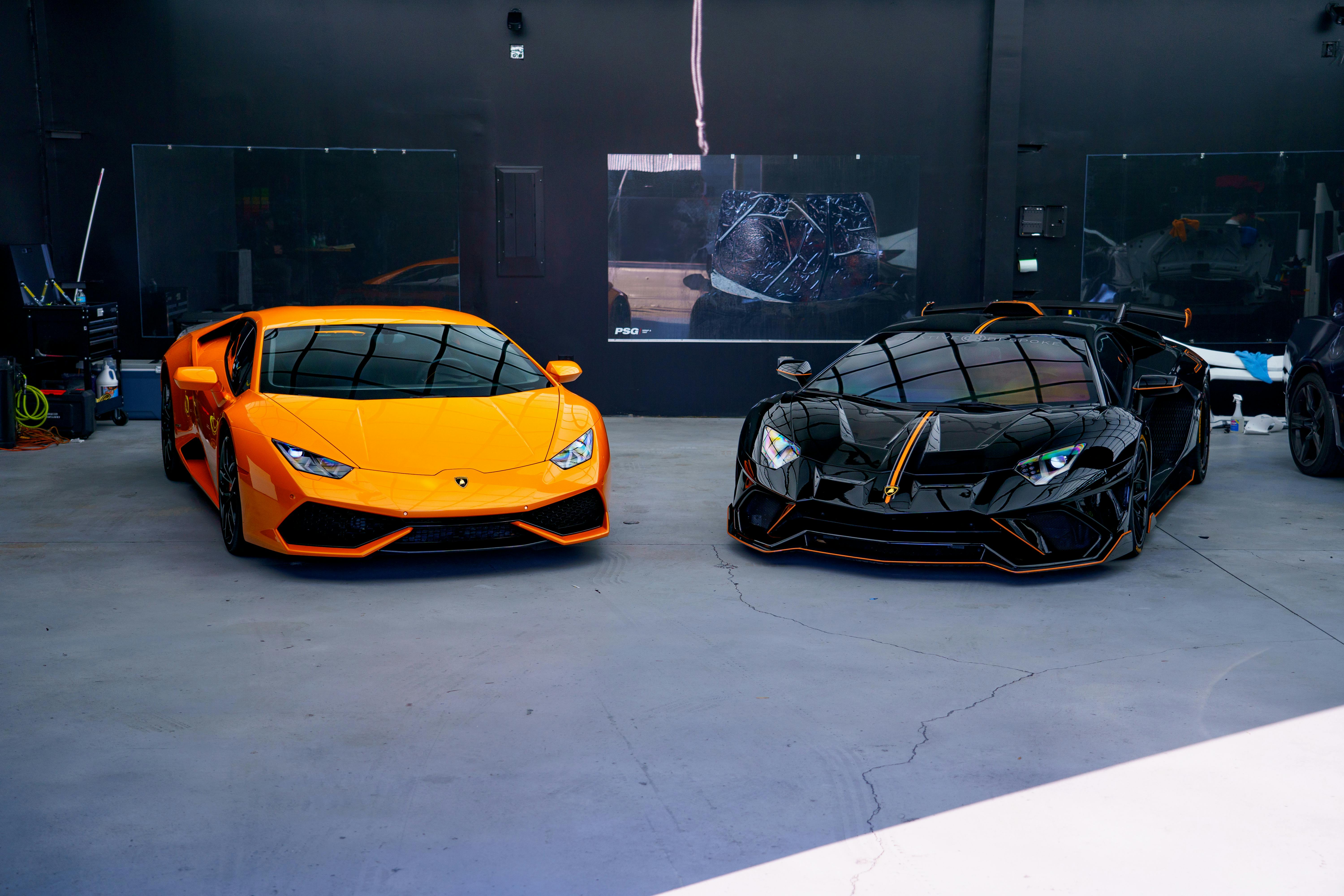 Luxury Sports Cars in Modern Garage Setting · Free Stock Photo