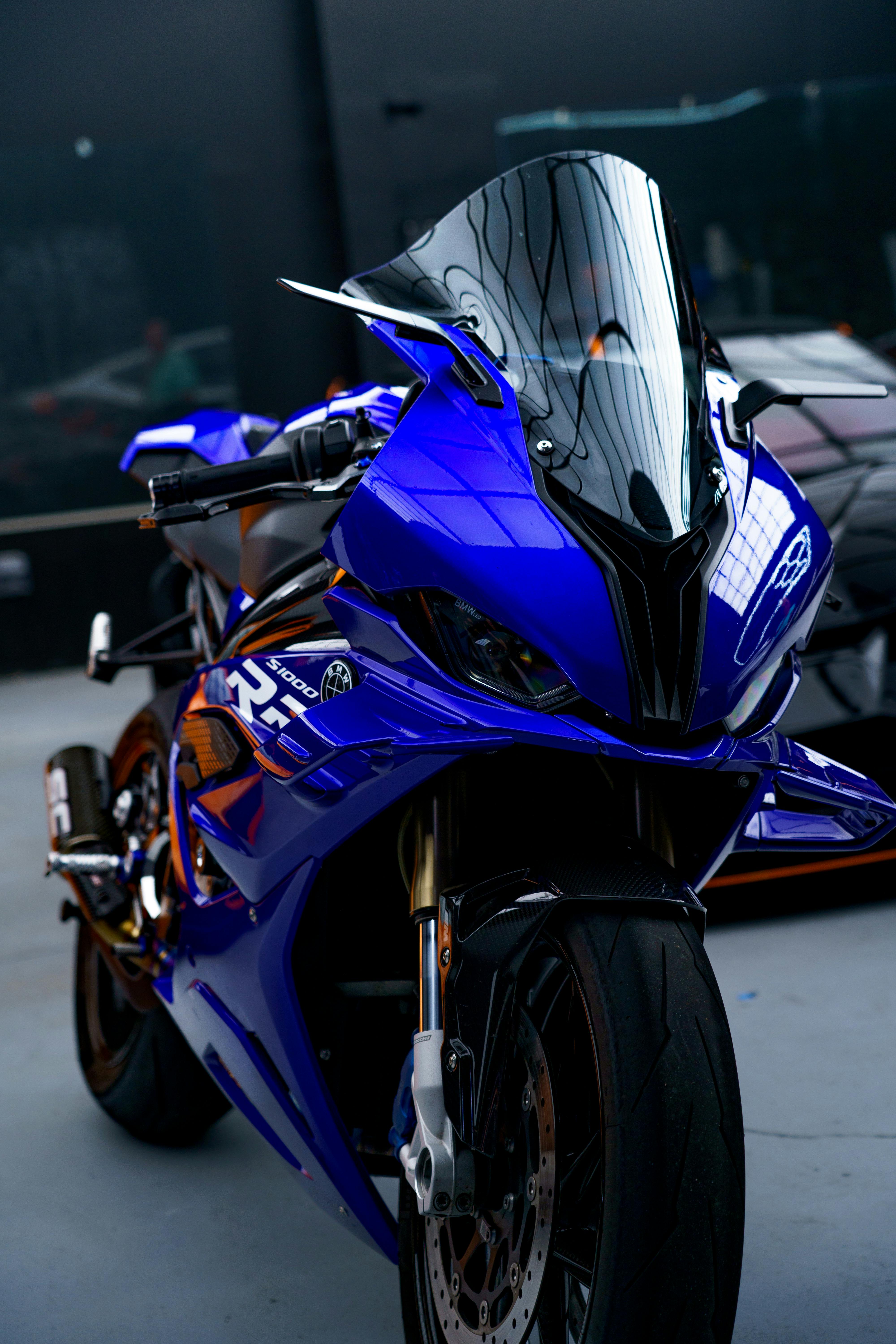 Striking Blue Sport Motorcycle in Urban Garage · Free Stock Photo