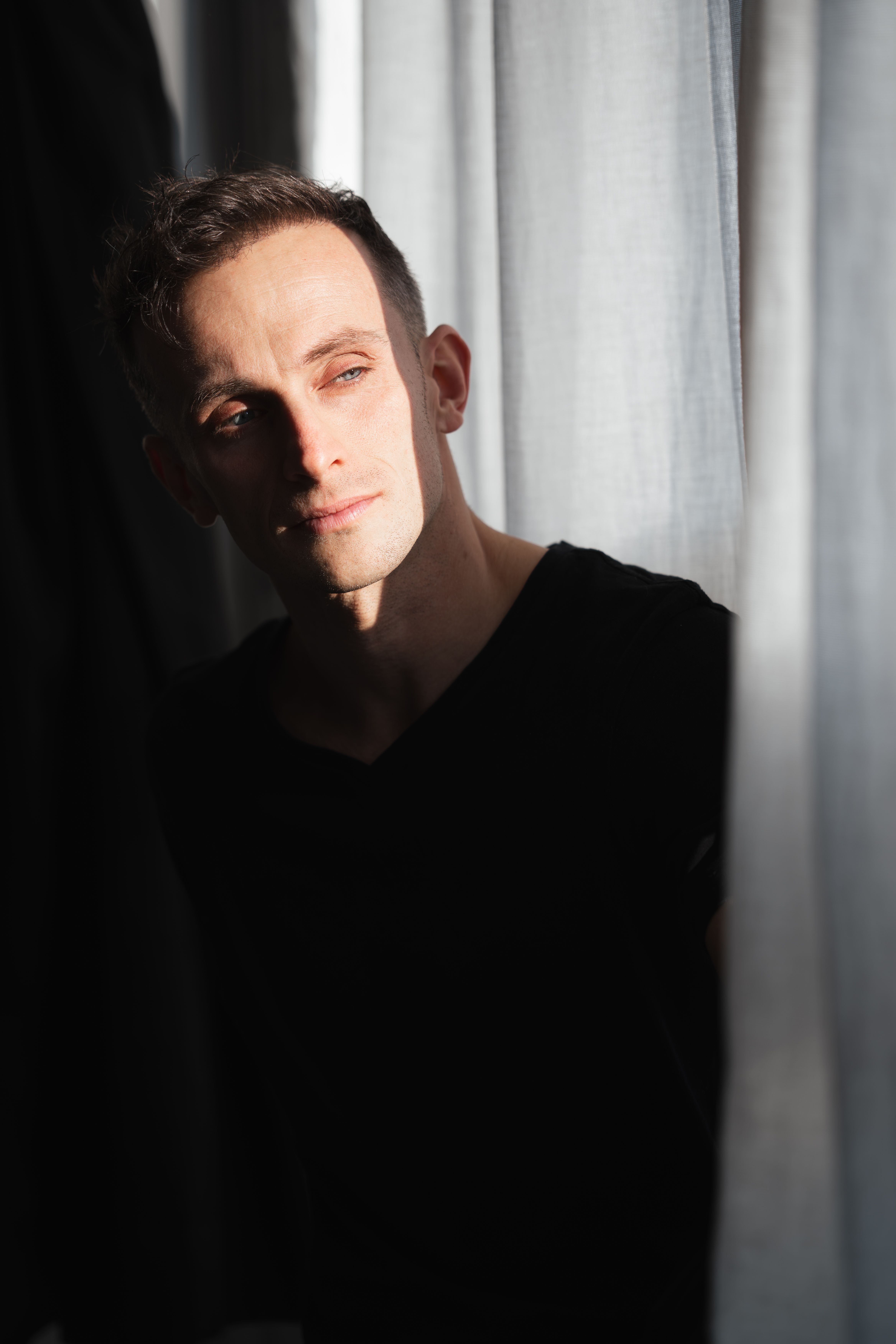 Portrait of a Man in Dramatic Window Lighting · Free Stock Photo