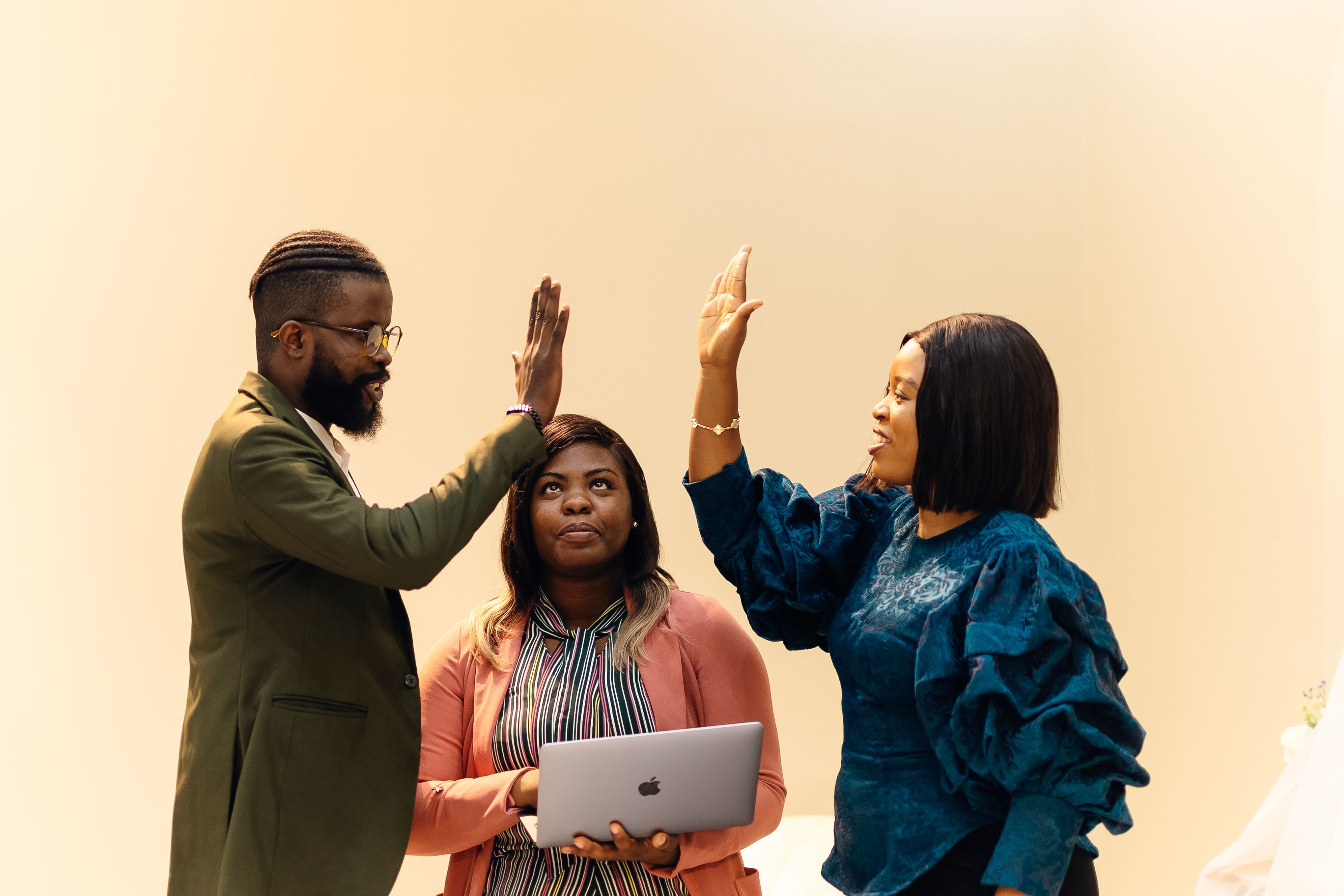 Team Celebrating Together with High Five · Free Stock Photo