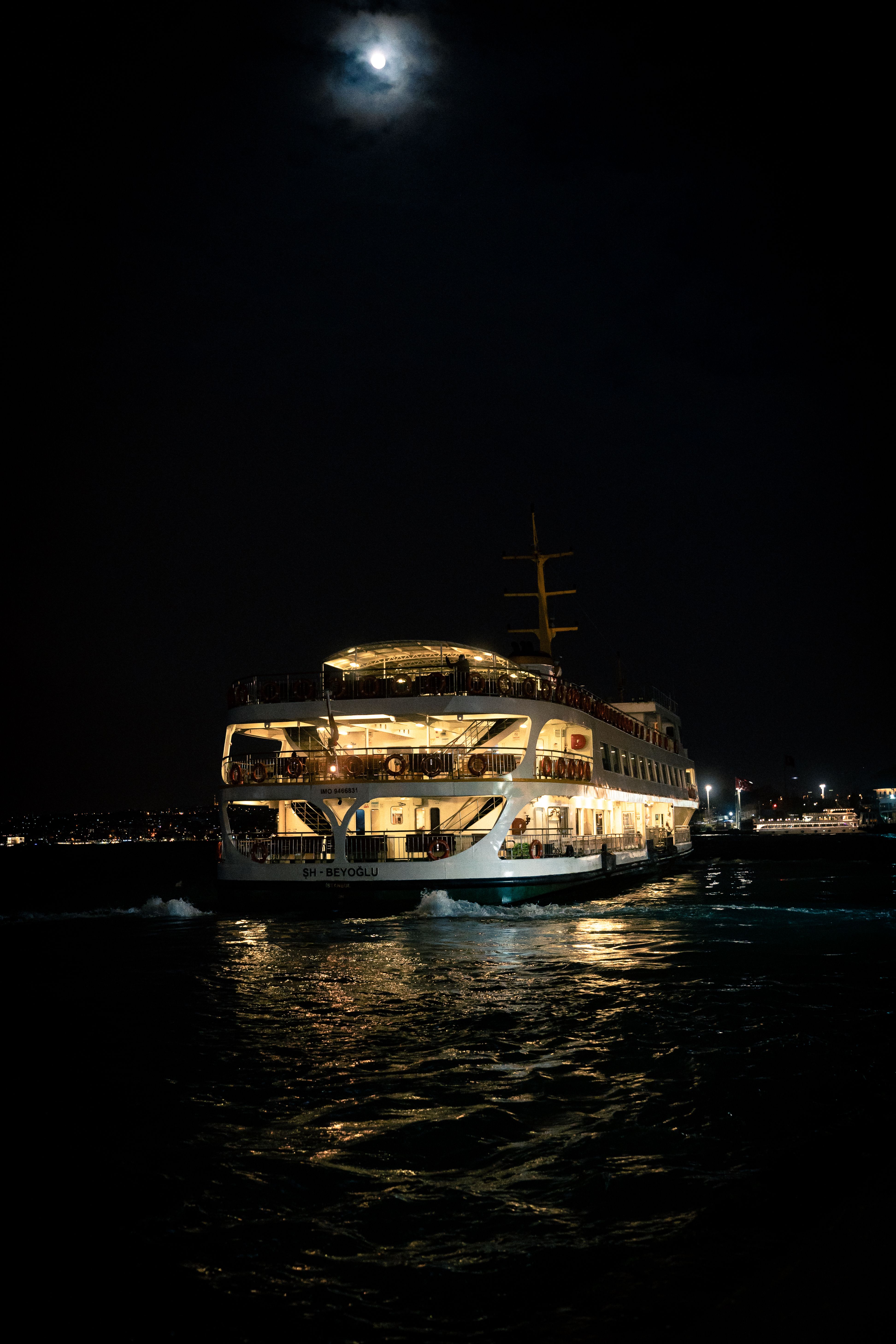Illuminated Ferry at Night under Moonlit Sky · Free Stock Photo