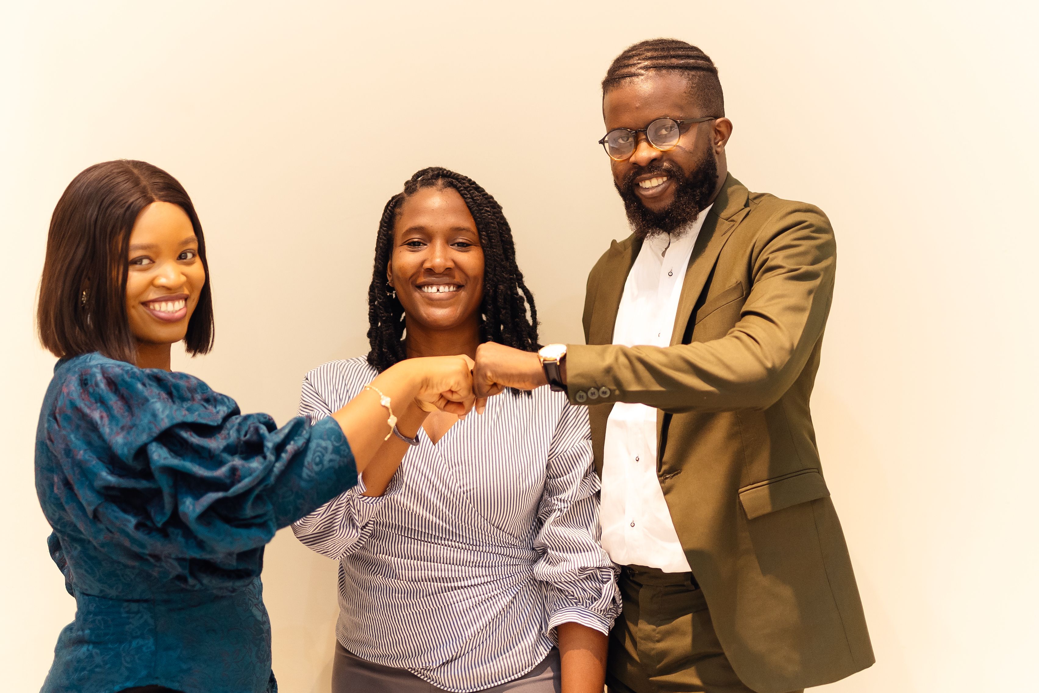 Diverse Team Celebrating Success in Lagos Office · Free Stock Photo
