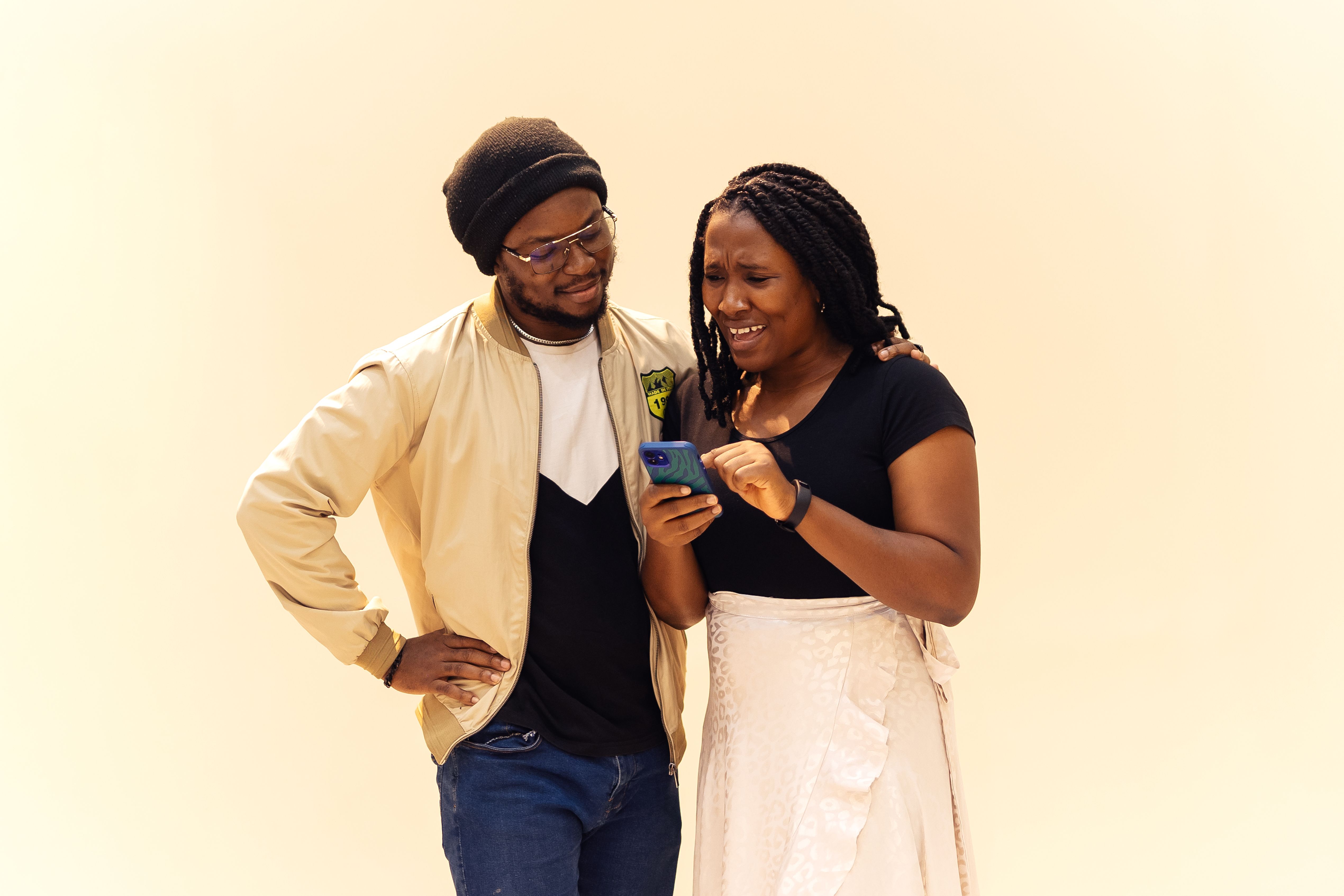 Young Couple Enjoying Smartphone Interaction · Free Stock Photo