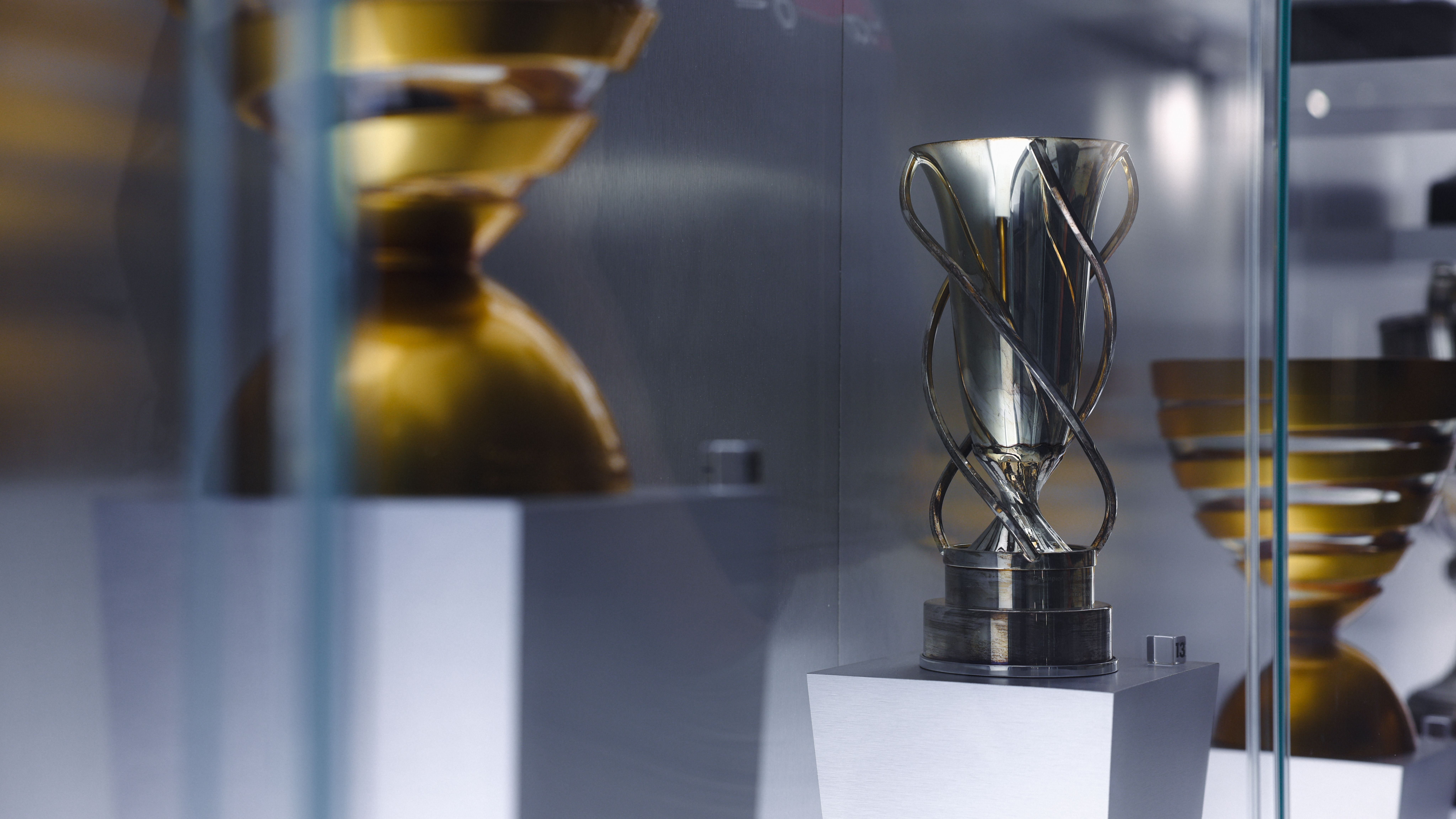 Elegant Trophy Display in a Glass Case · Free Stock Photo